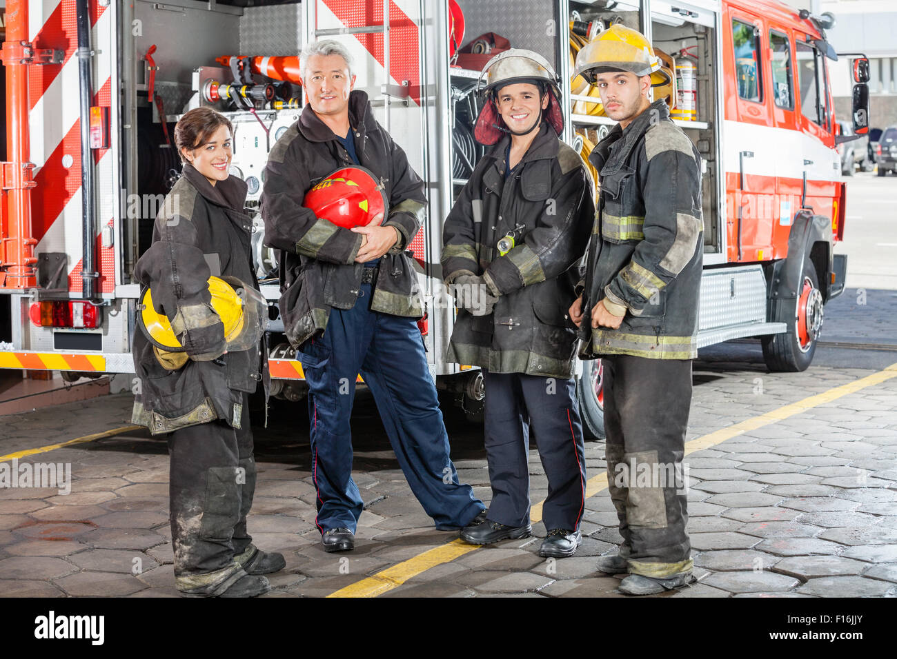 Confident Team Of Firefighters Against Truck Stock Photo - Alamy
