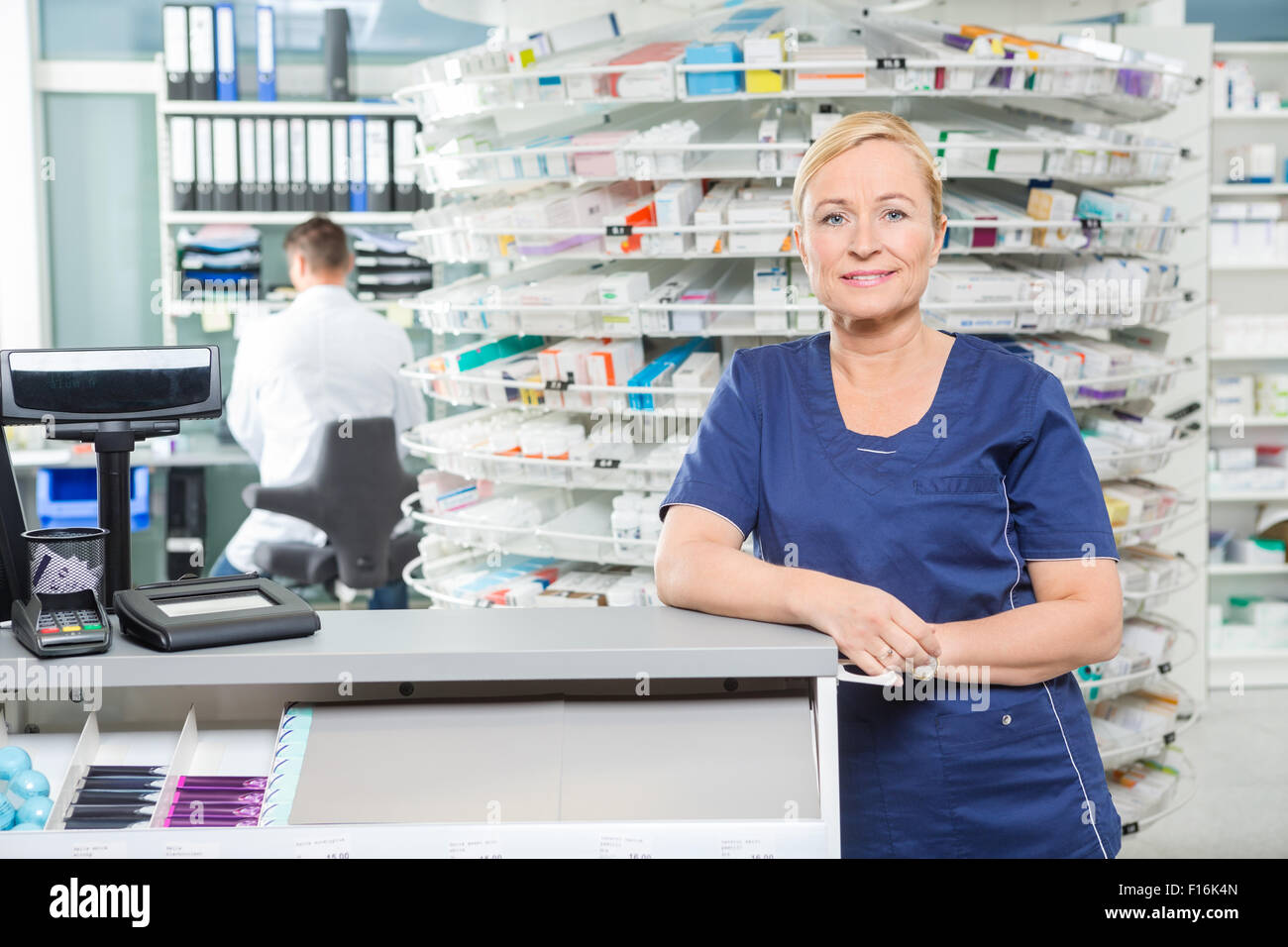 Woman pharmacy cashier hi-res stock photography and images - Alamy