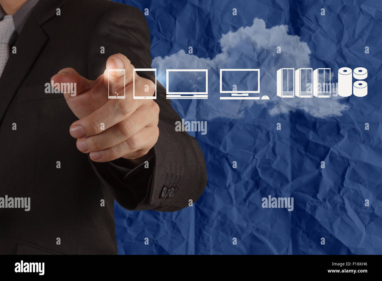Businessman hand working with a Cloud Computing diagram on blue ...