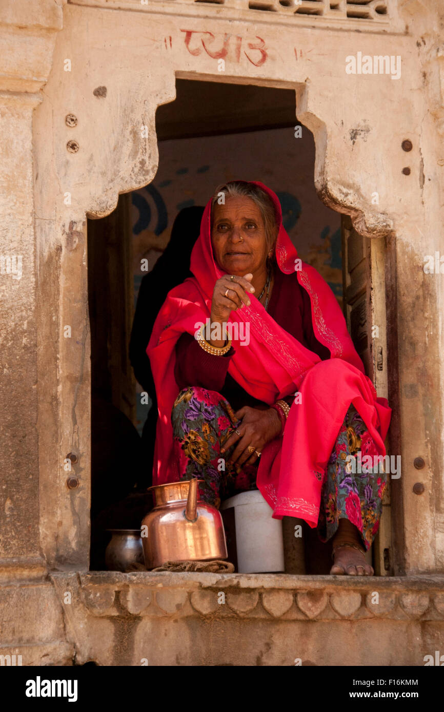 Woman makes tea at temple in Rajasthan, India Stock Photo - Alamy