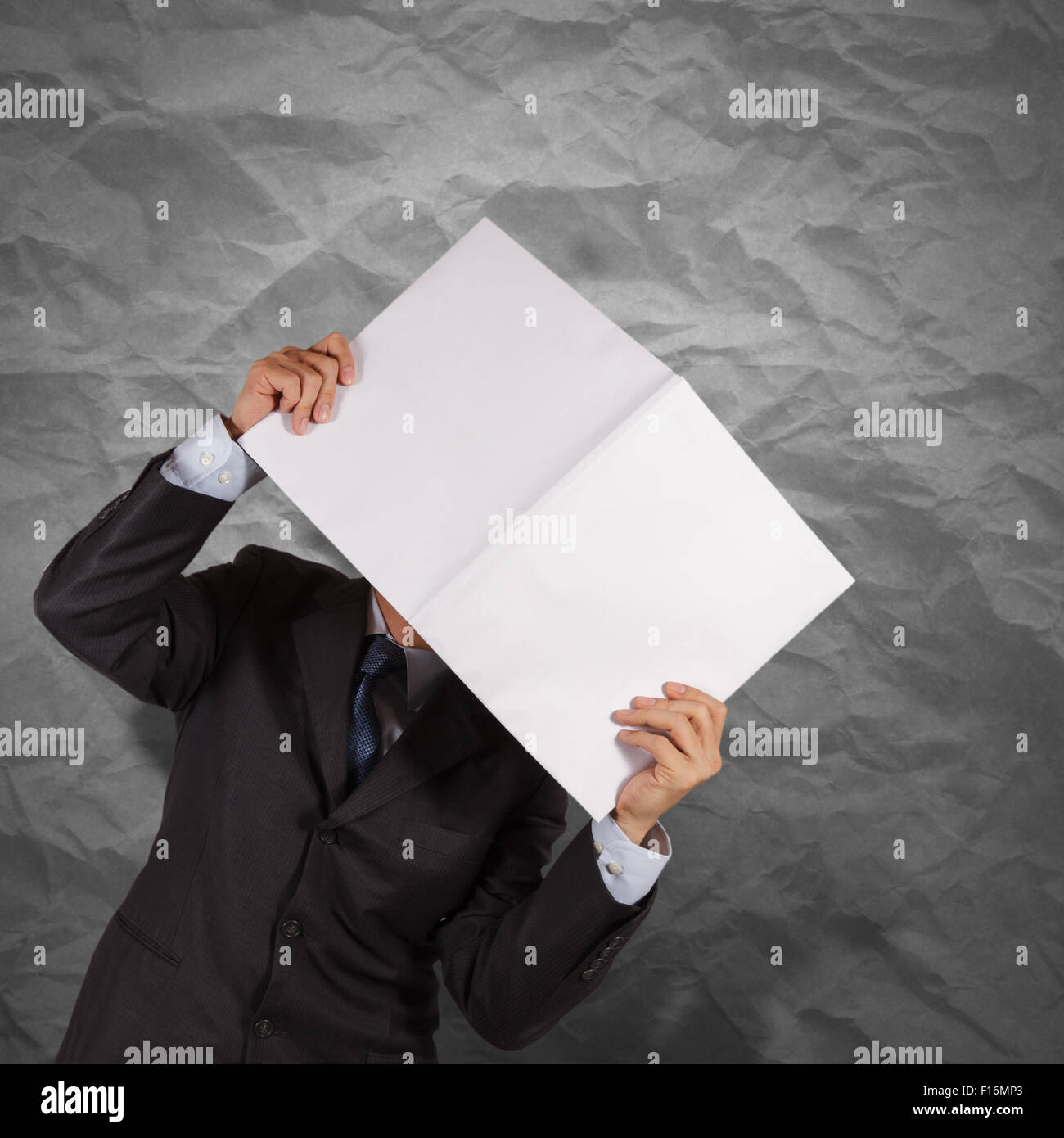 businessman hand show black cover book with crumpled recycle paper ...