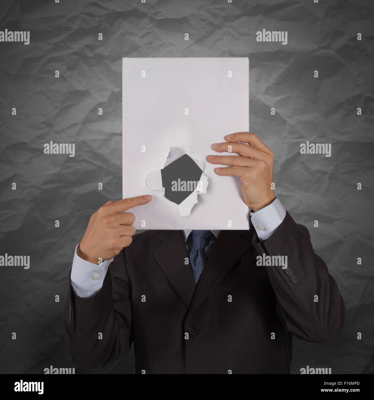 businessman hand show black cover book with crumpled recycle paper ...