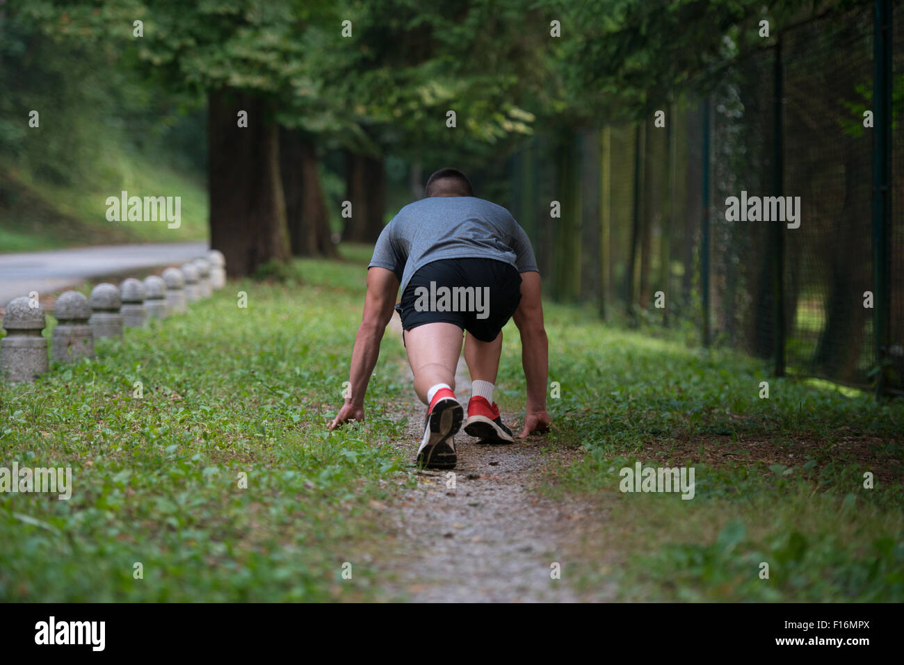 Male Athlete Runner In Starting Line Ready For Running And Sprint ...