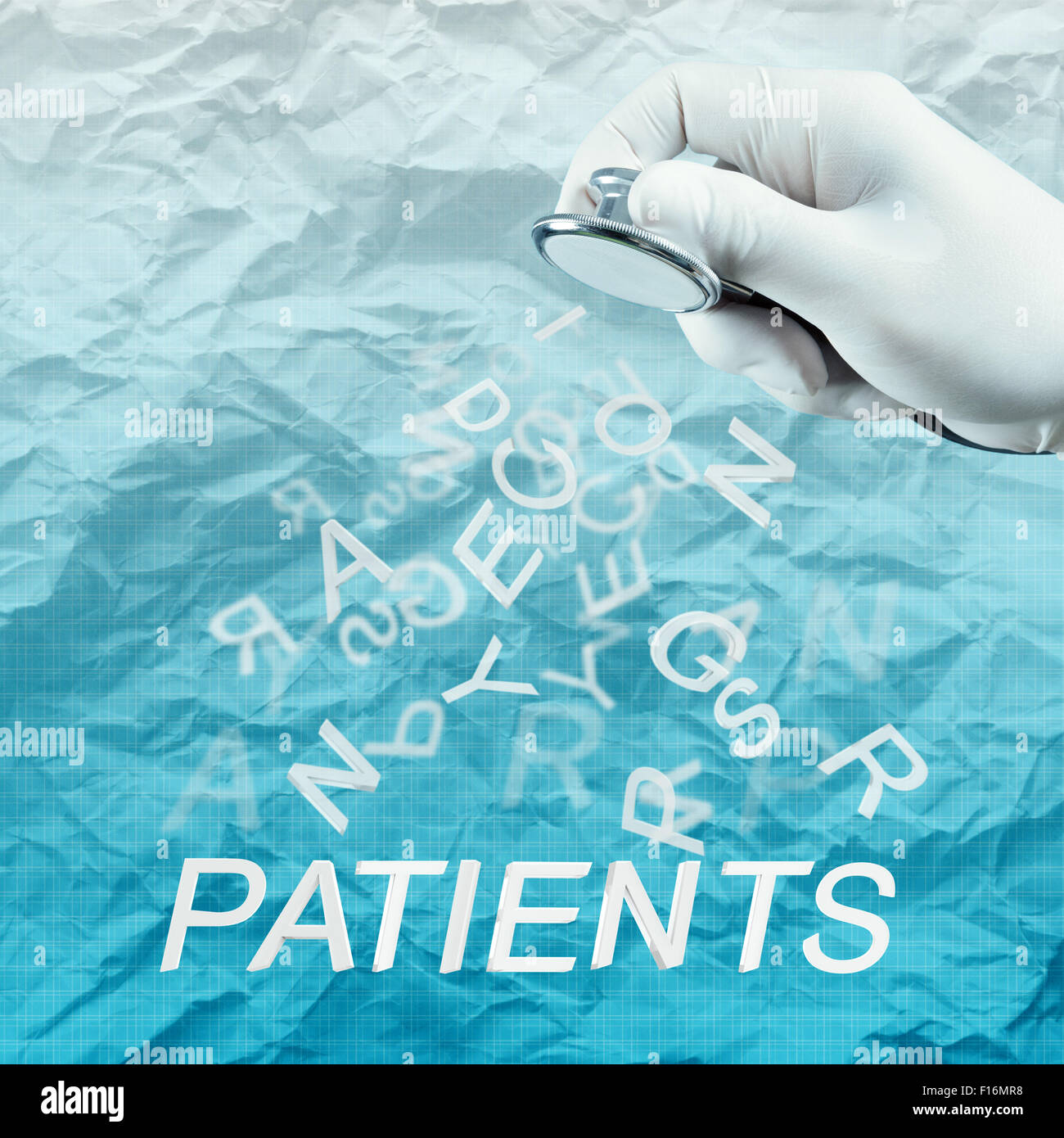 Stethoscope in hand with patient word and crumpled paper background as ...