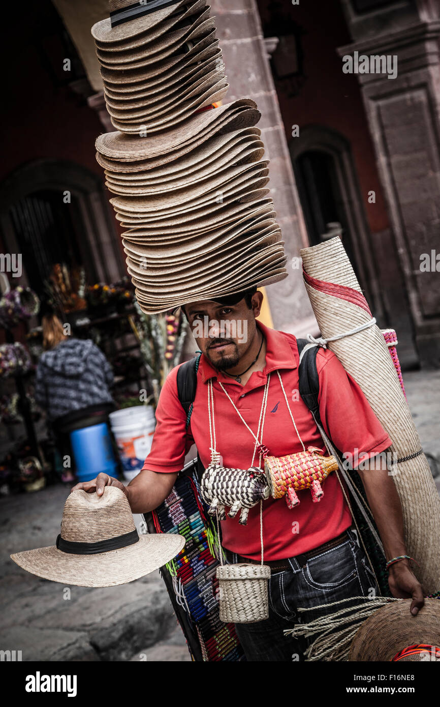 Guy selling hats at San Miguel de Allende Plaza, Mexico Stock Photo - Alamy