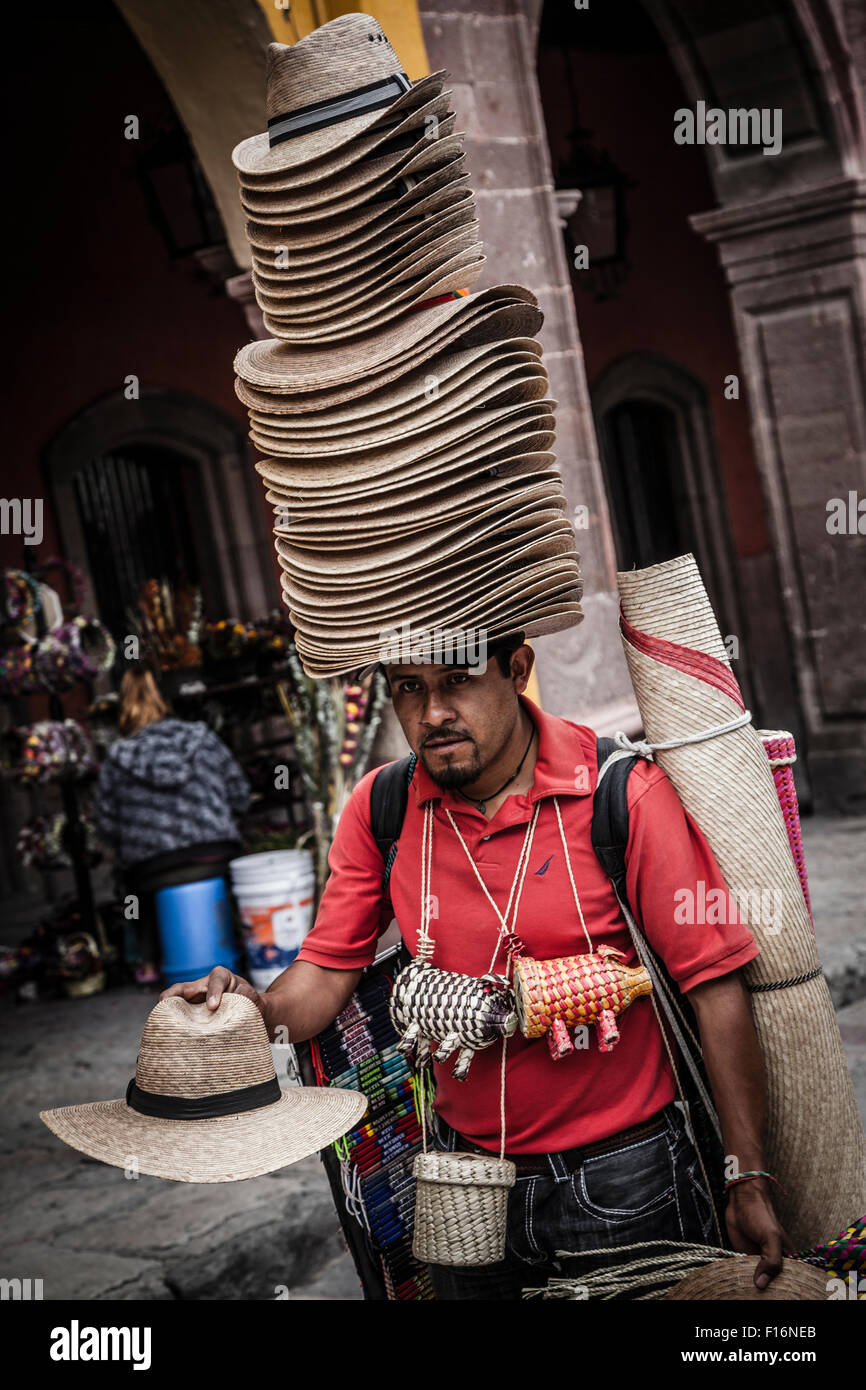 Guy selling hats at San Miguel de Allende Plaza, Mexico Stock Photo - Alamy