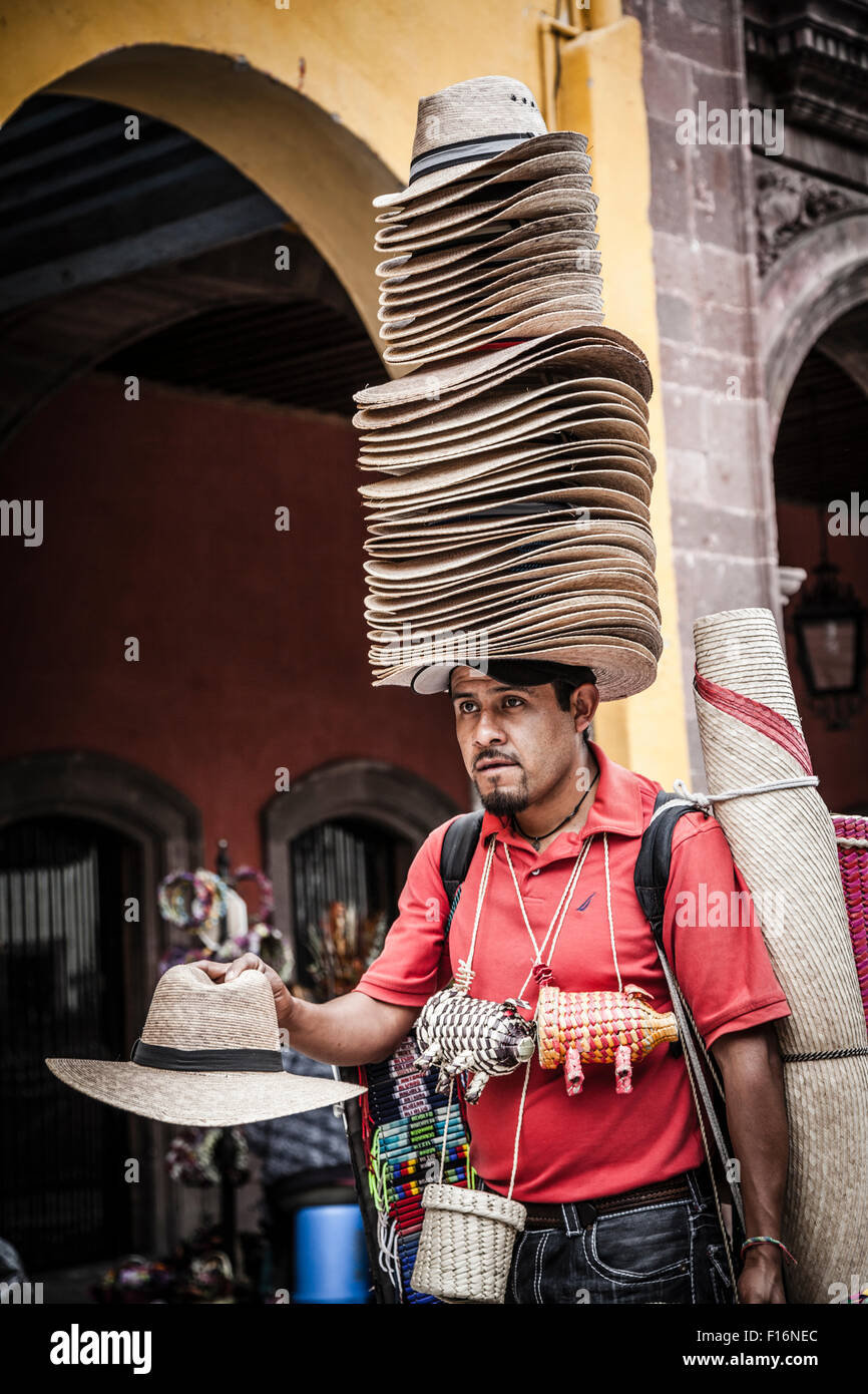 Guy selling hats at San Miguel de Allende Plaza, Mexico Stock Photo - Alamy