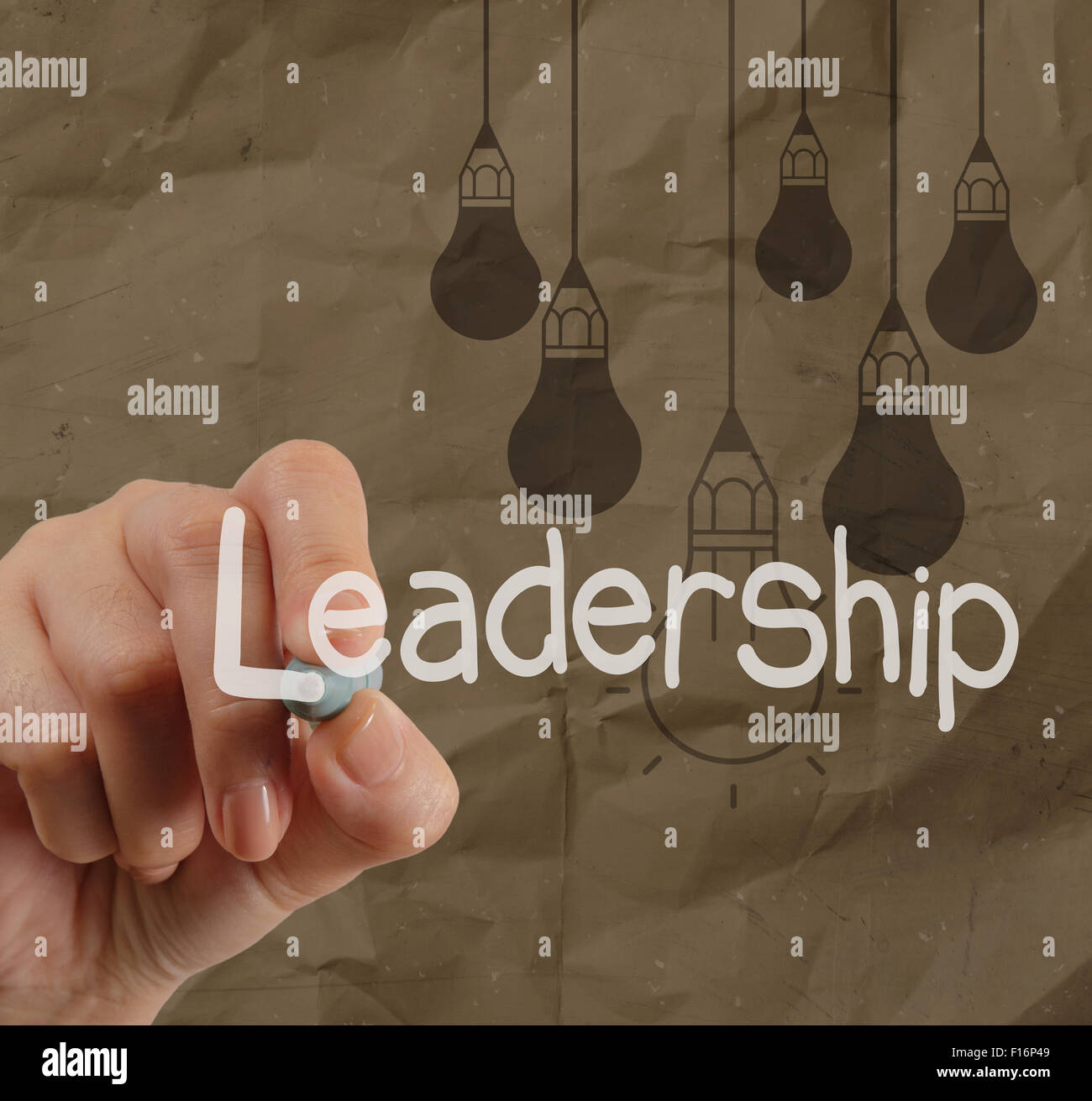 hand writing leadership with crumpled recycle paper background as ...