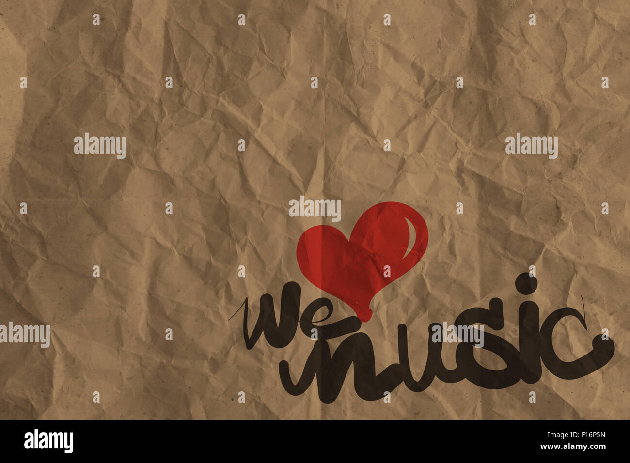 we love music phrase handwritten on crumpled recycle paper background ...