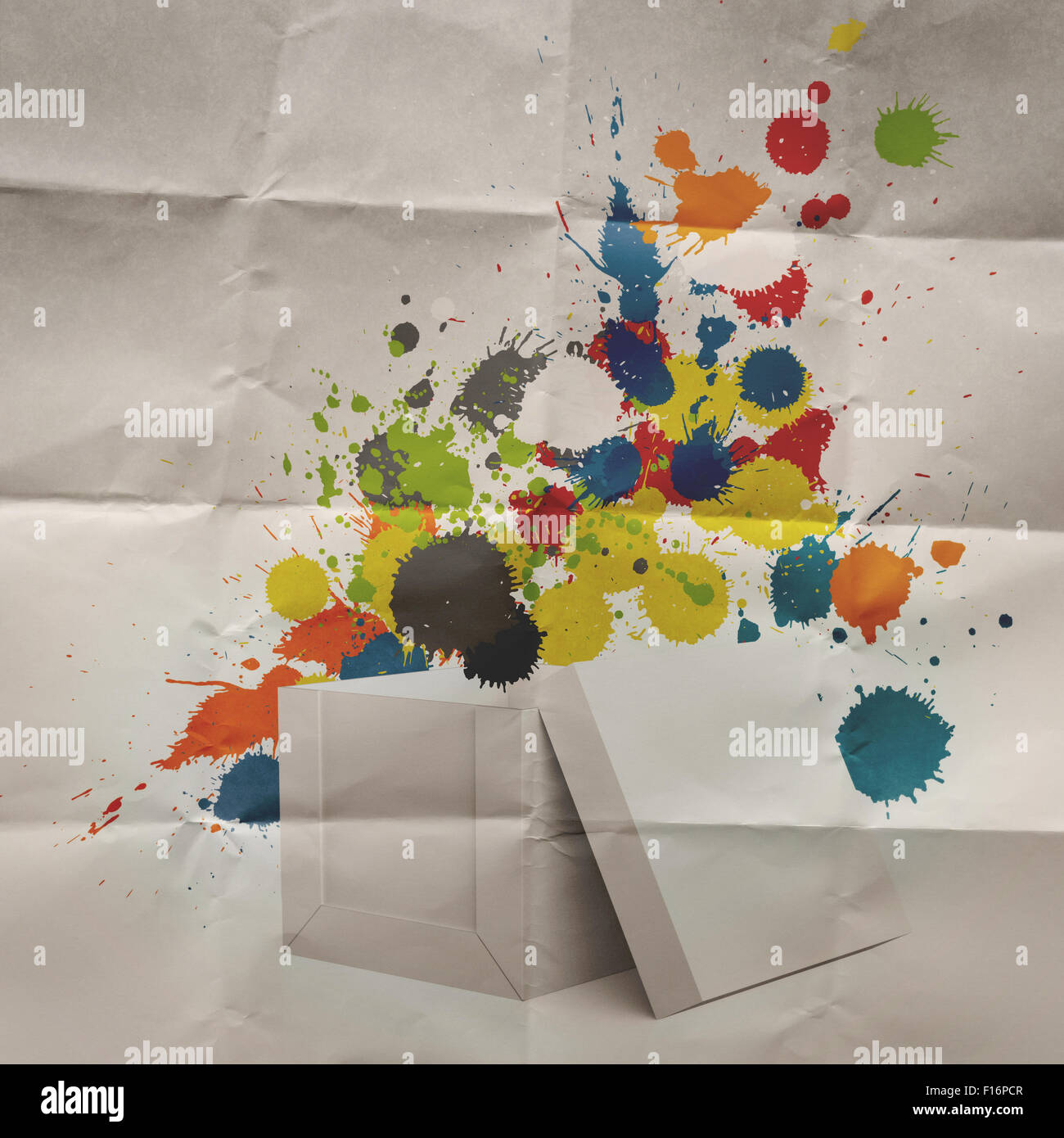 thinking outside the box and splash colors crumpled paper as concept ...