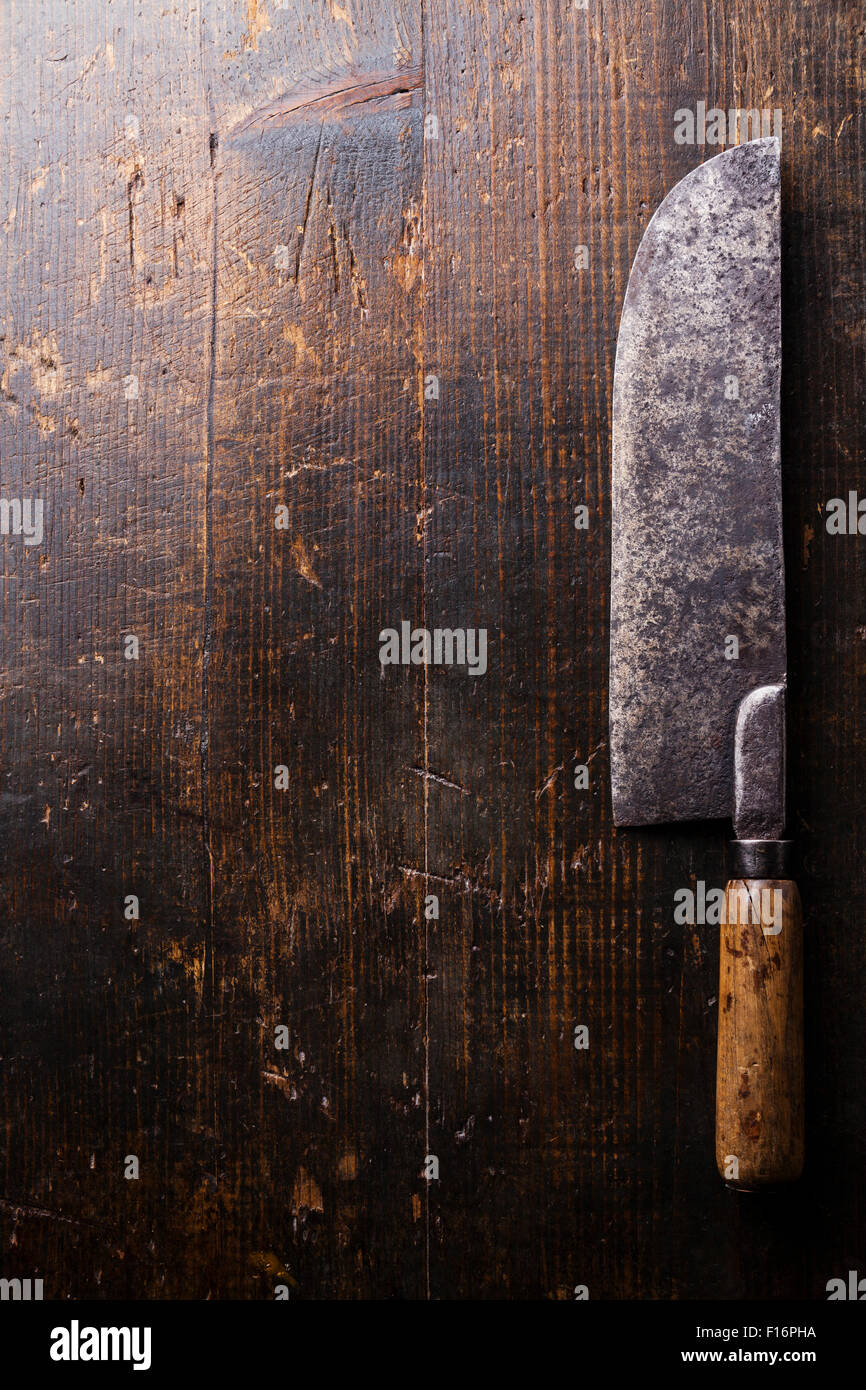 Vintage Meat cleaver on dark wooden background Stock Photo - Alamy