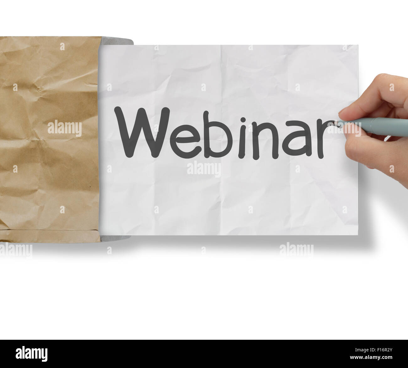 hand writing Webinar with crumpled paper with recycle envelope as ...