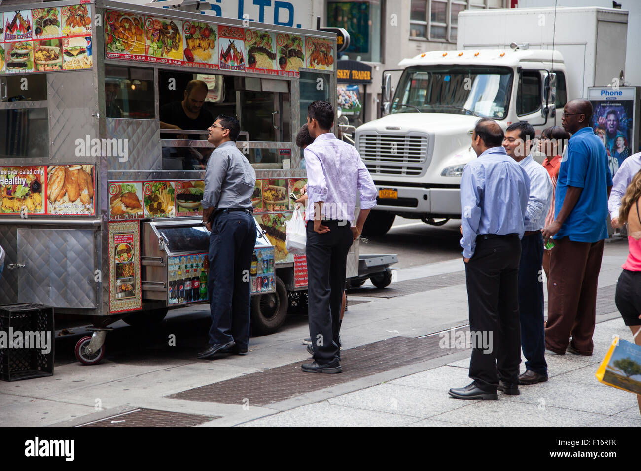 Businessmen during lunch at food cart Stock Photo - Alamy