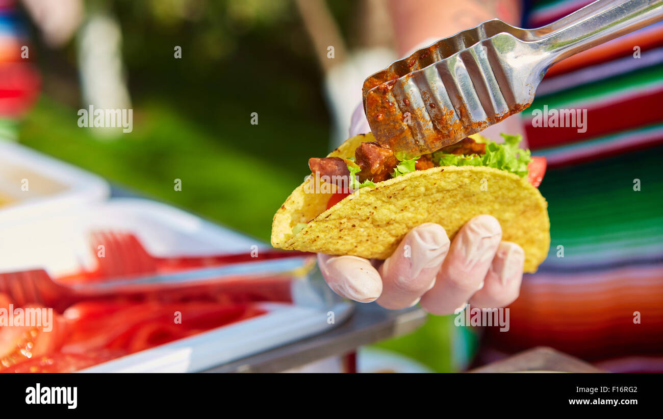 Chef making tacos at a street cafe Stock Photo - Alamy
