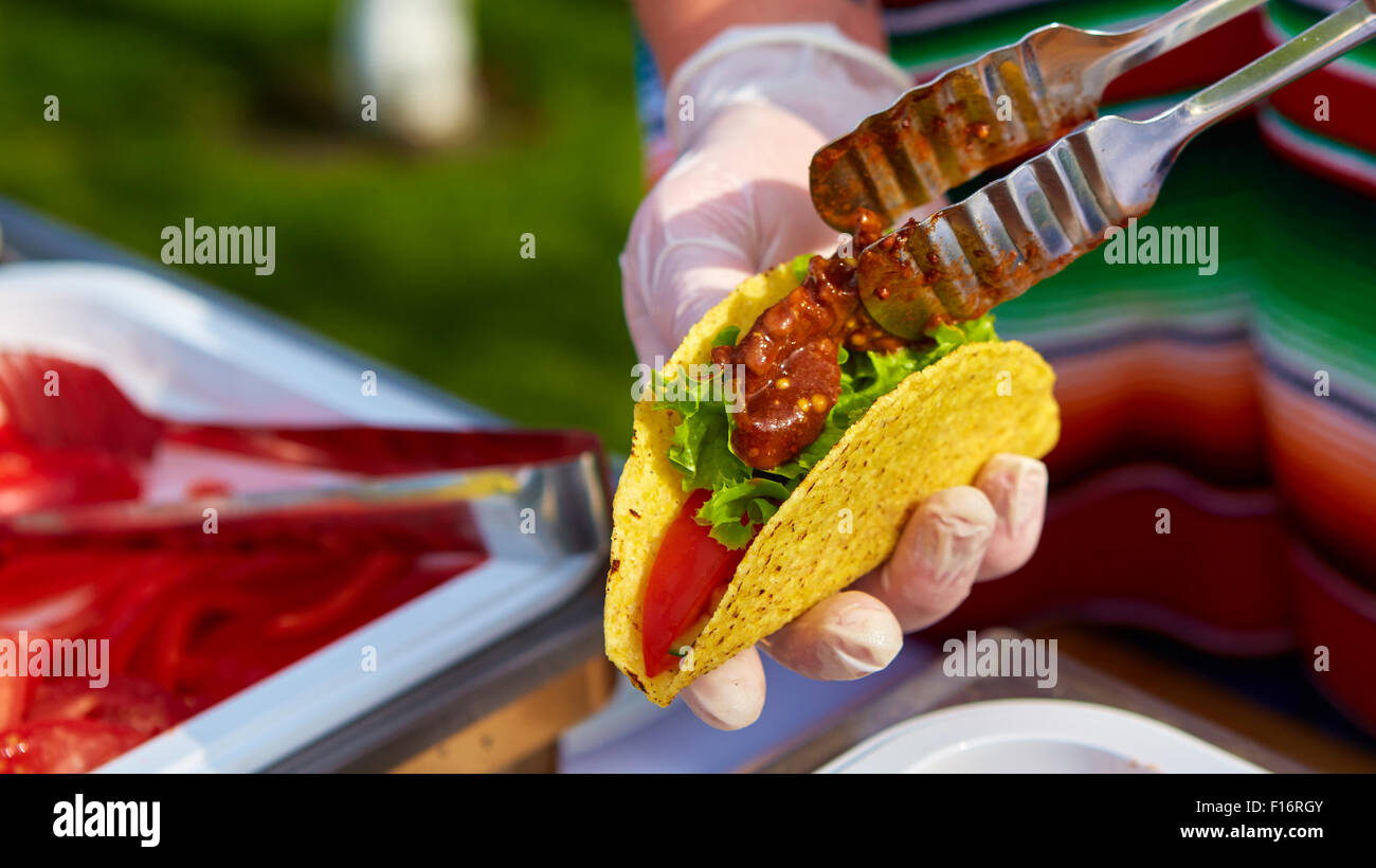 Chef making tacos at a street cafe Stock Photo - Alamy