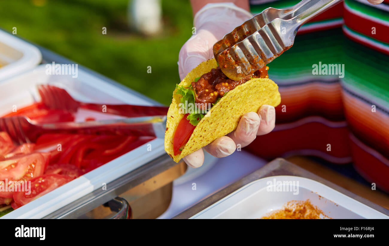 Chef making tacos at a street cafe Stock Photo - Alamy