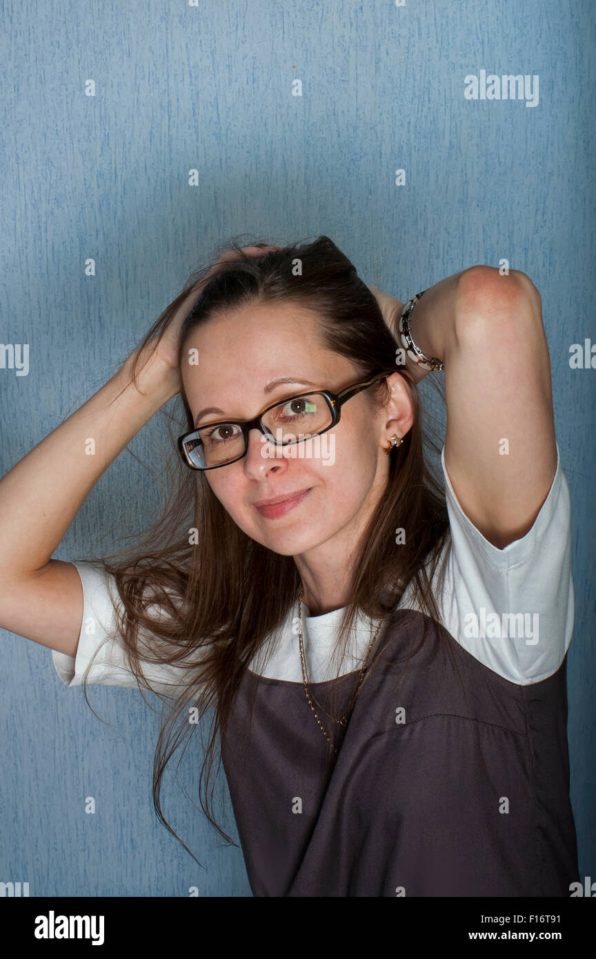 Woman Fixing Hair Stock Photo - Alamy
