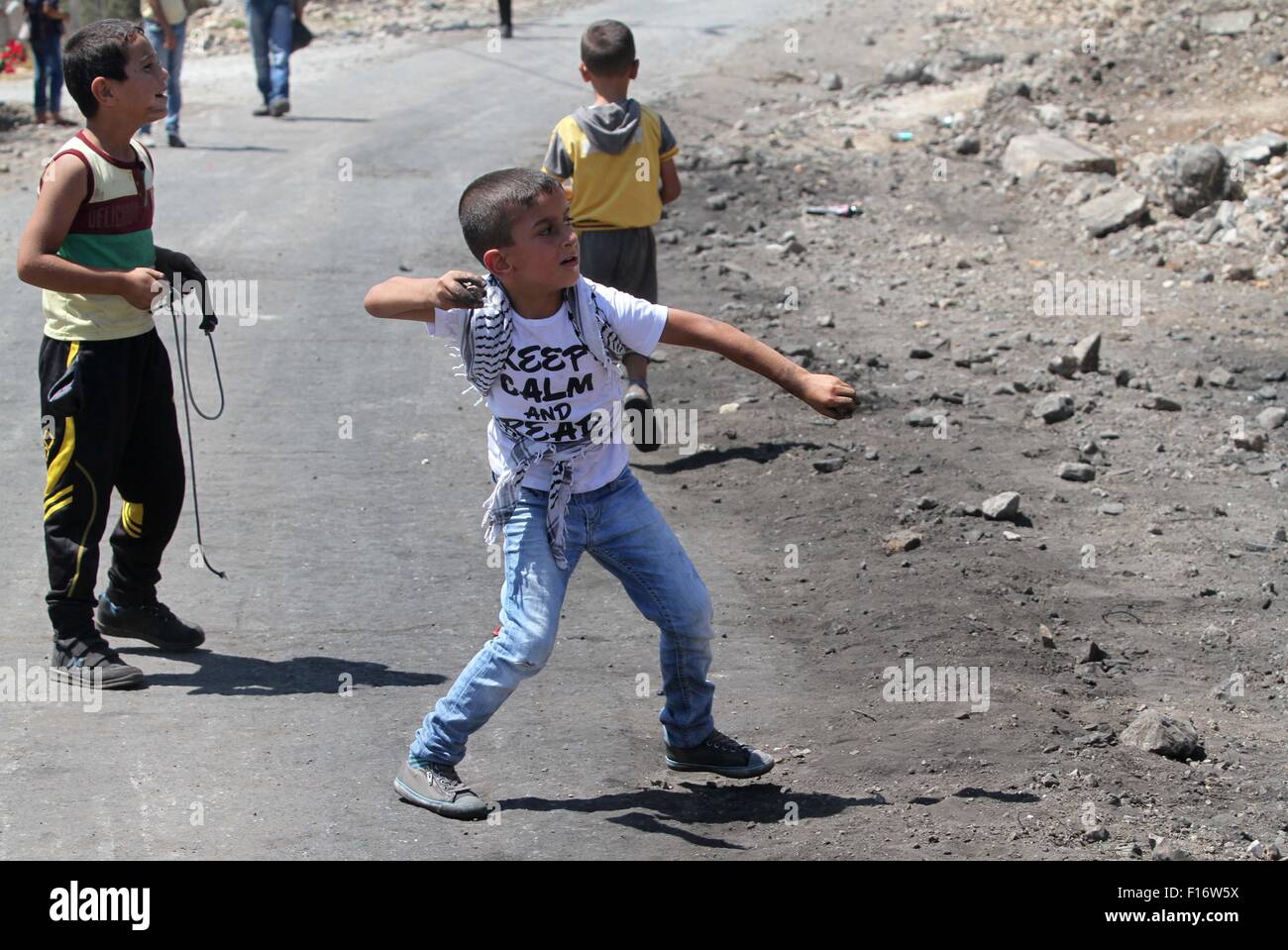 Boy throws stones hi-res stock photography and images - Alamy