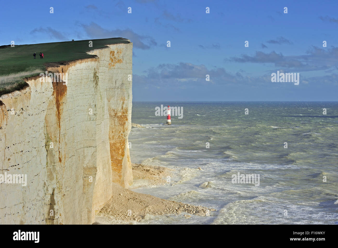 View over the eroded white chalk cliffs and lighthouse at Beachy Head ...