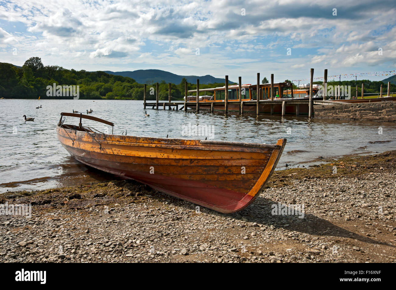 Rowing boats boat at the lakeside lake in summer Derwentwater Keswick ...