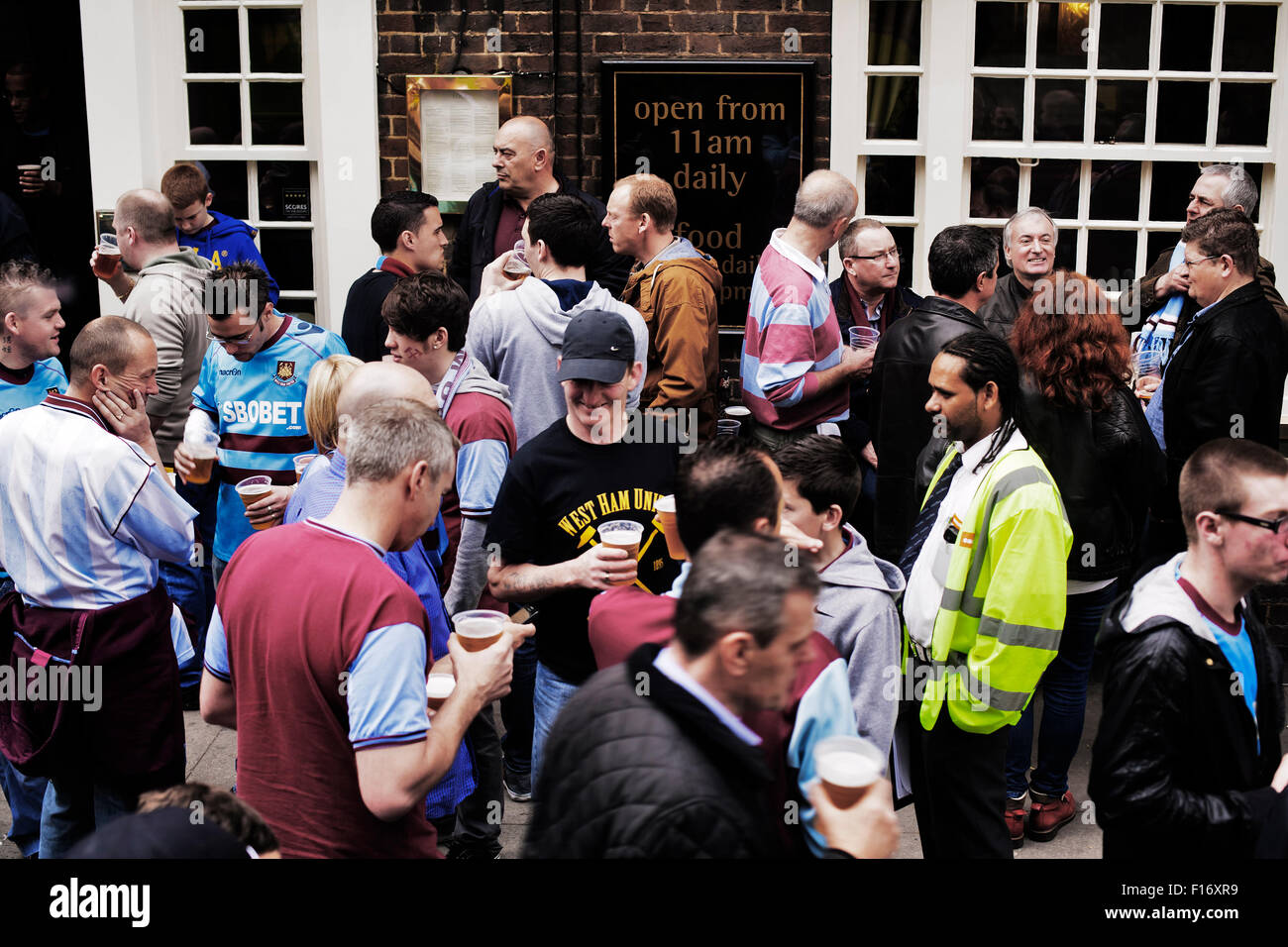 West Ham United Football Supporters chatting and drinking outside ...