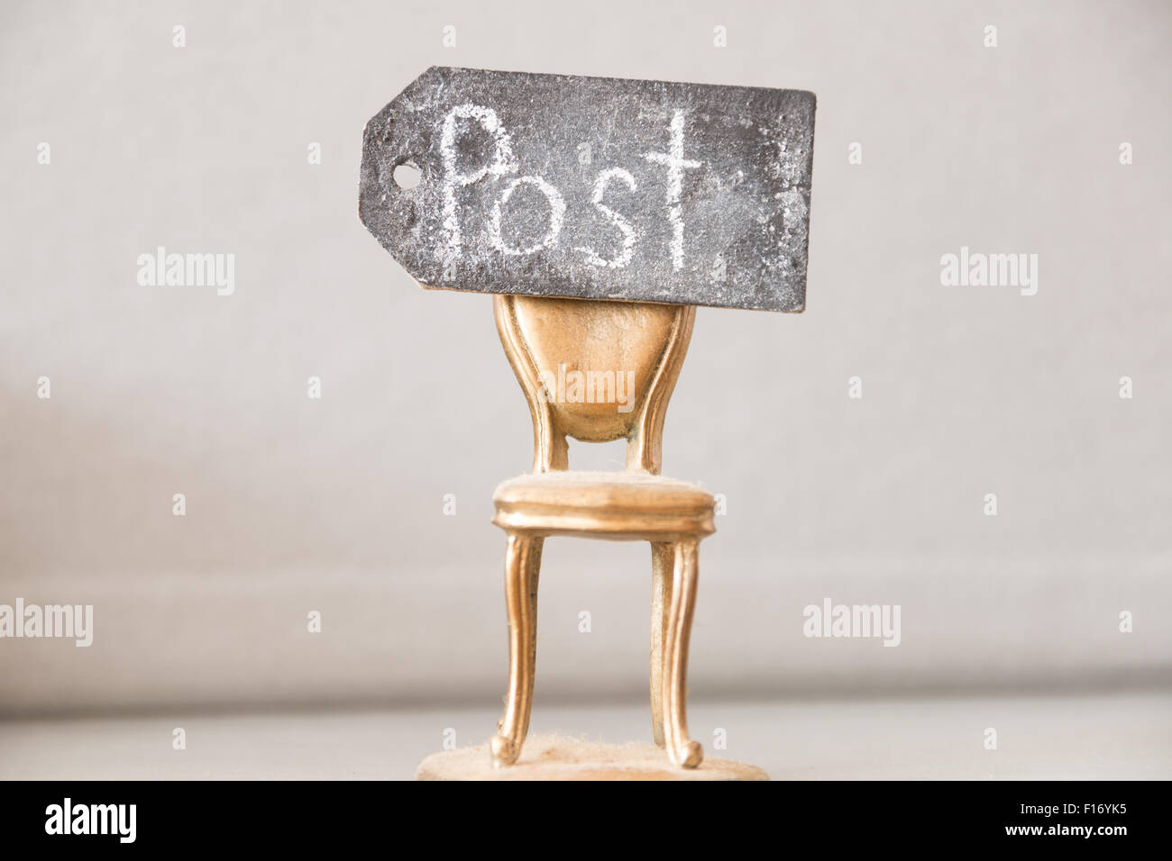 vacant post, golden chair, and an inscription in chalk "post Stock ...