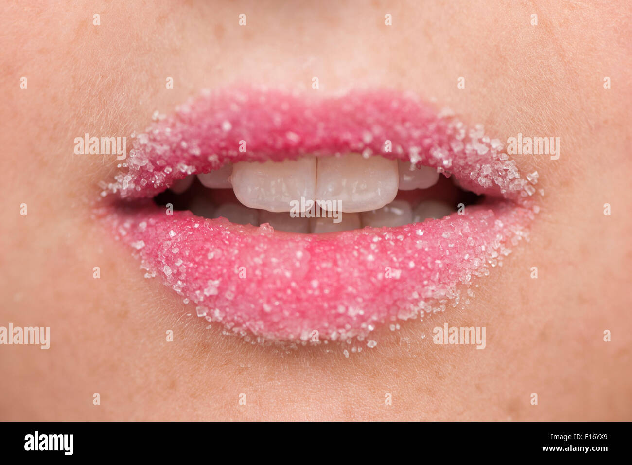 Candy covered lips close up Stock Photo - Alamy