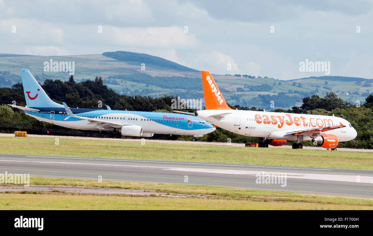 easyJet, Type: Airbus A320-214 about to take off. Thomson Airways, Type ...