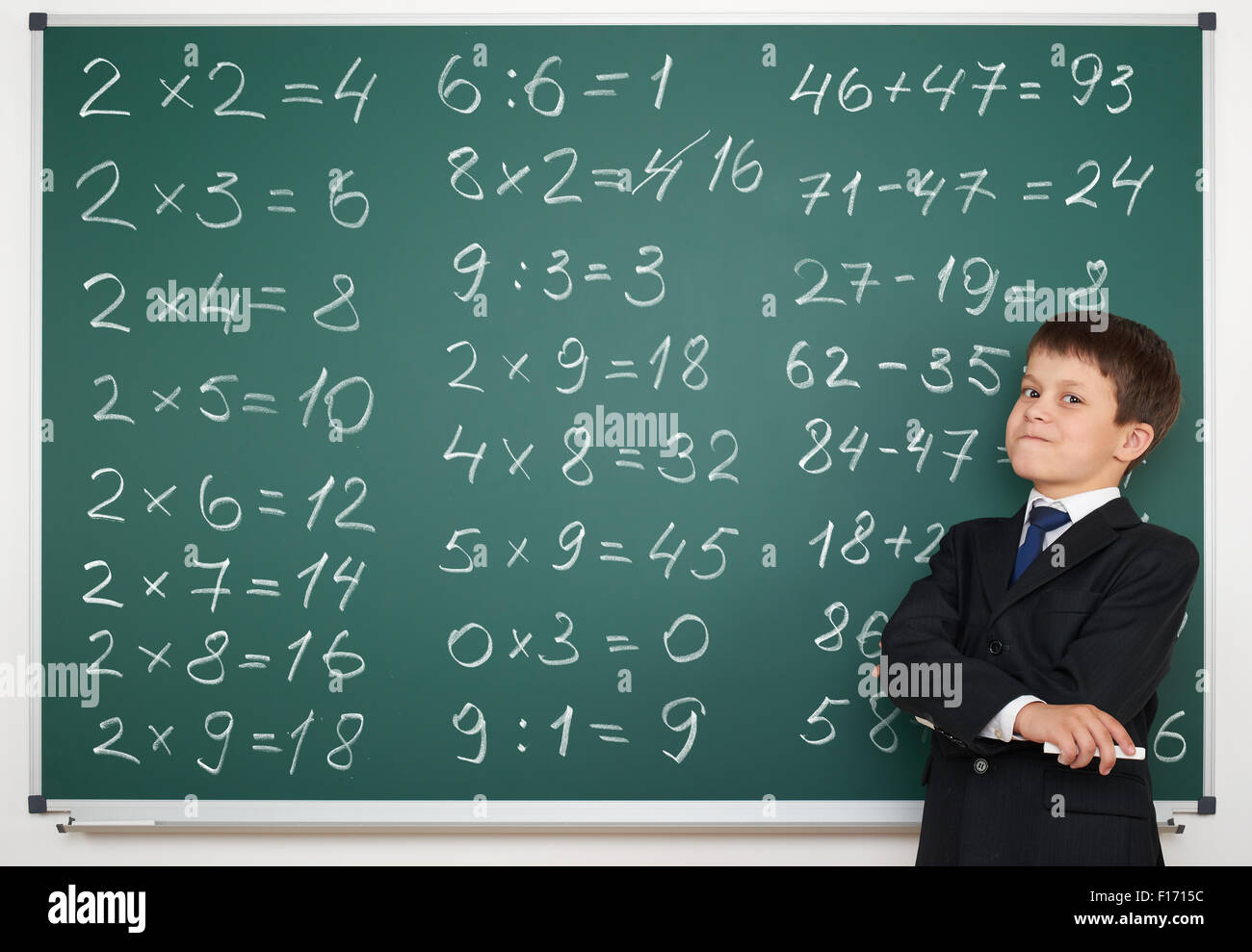 school boy solve math on board Stock Photo - Alamy
