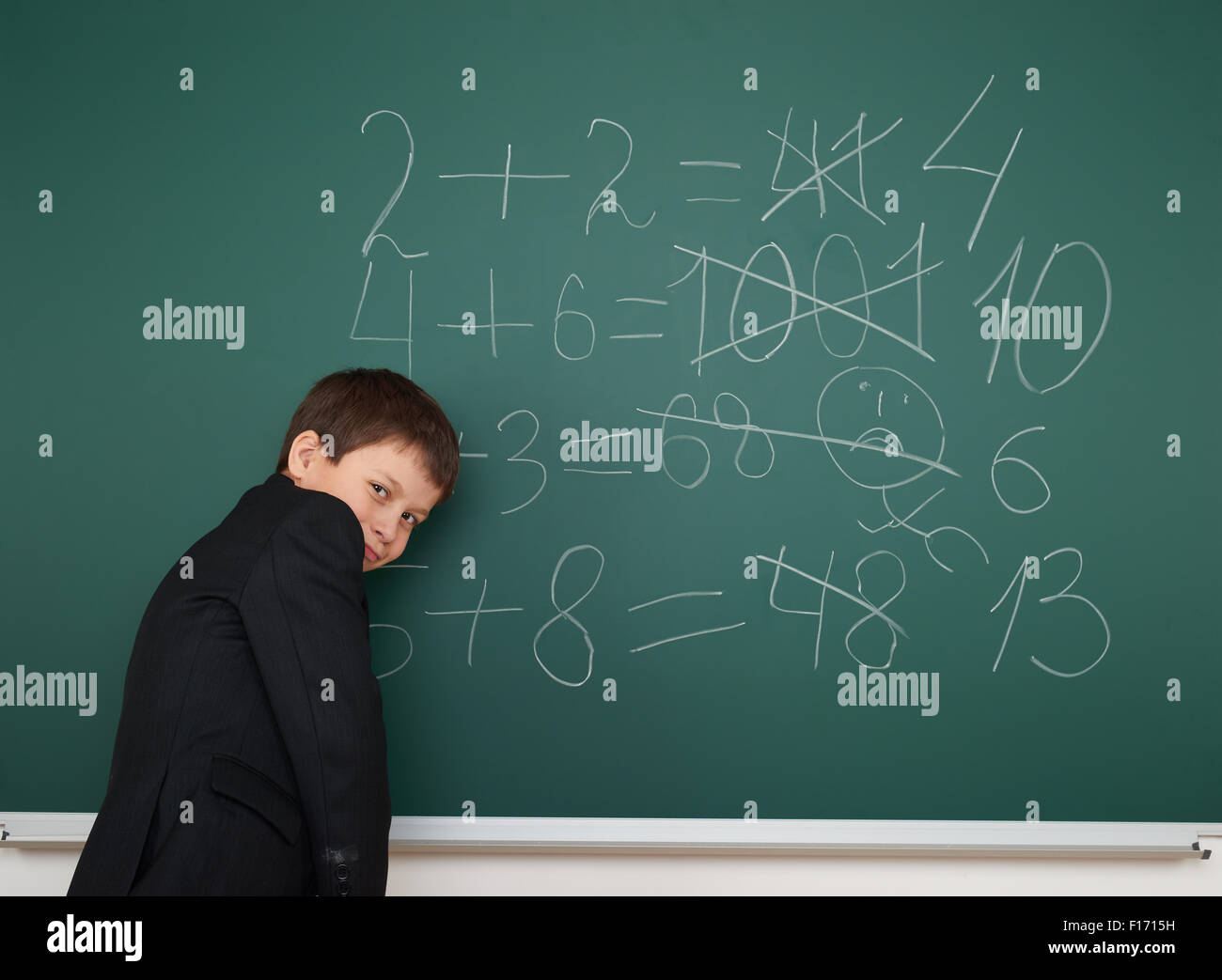 School boy solve math on the school board Stock Photo - Alamy