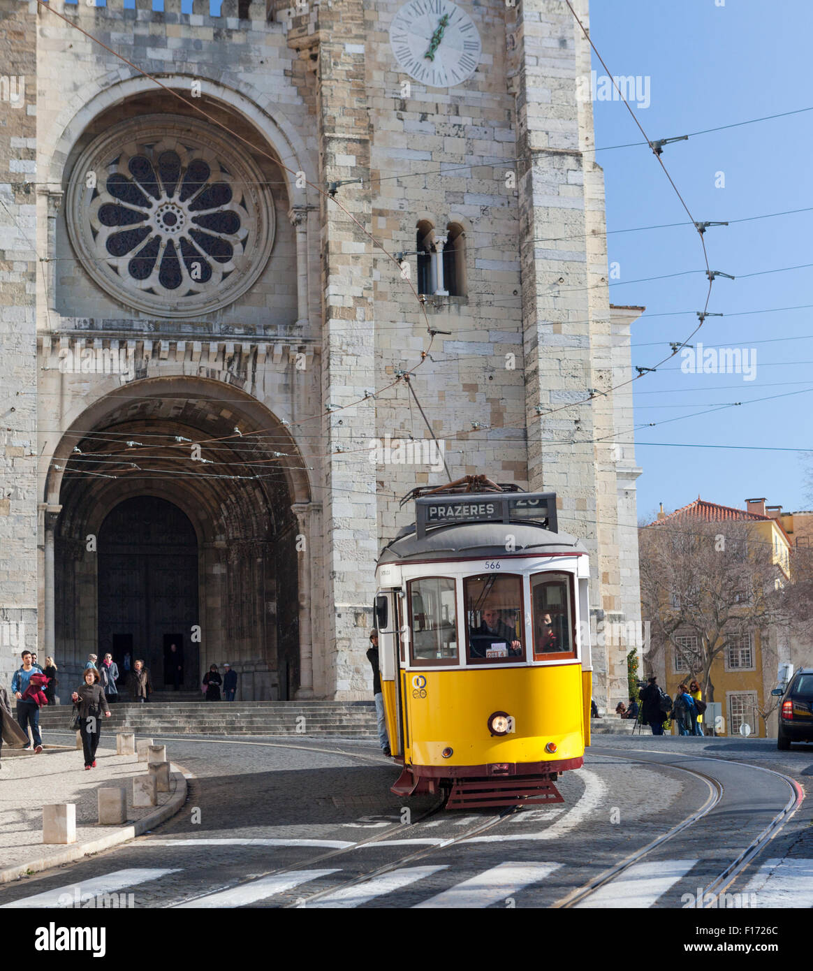 Trolley car descends Largo da Se in front of Catedral da Se in the ...