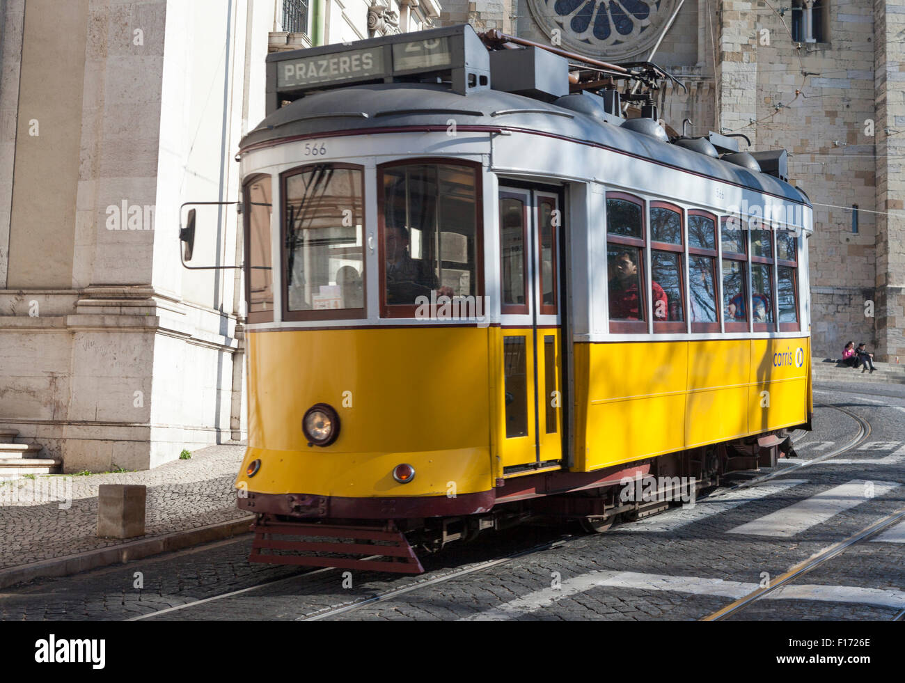 Trolley car descends Largo da Se in front of Catedral da Se in the ...
