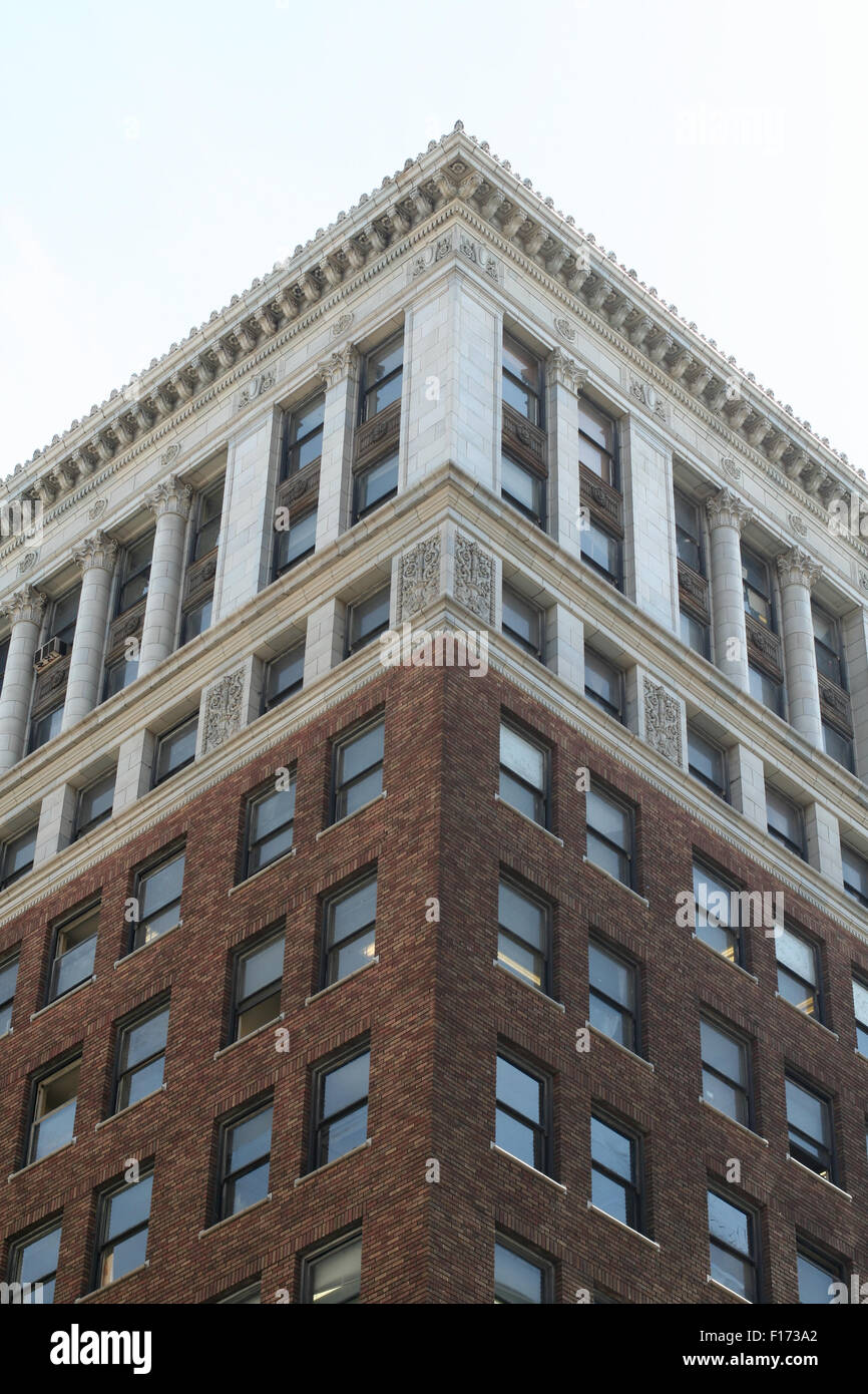 Corner perspective from below of a two tone bring and concrete building ...