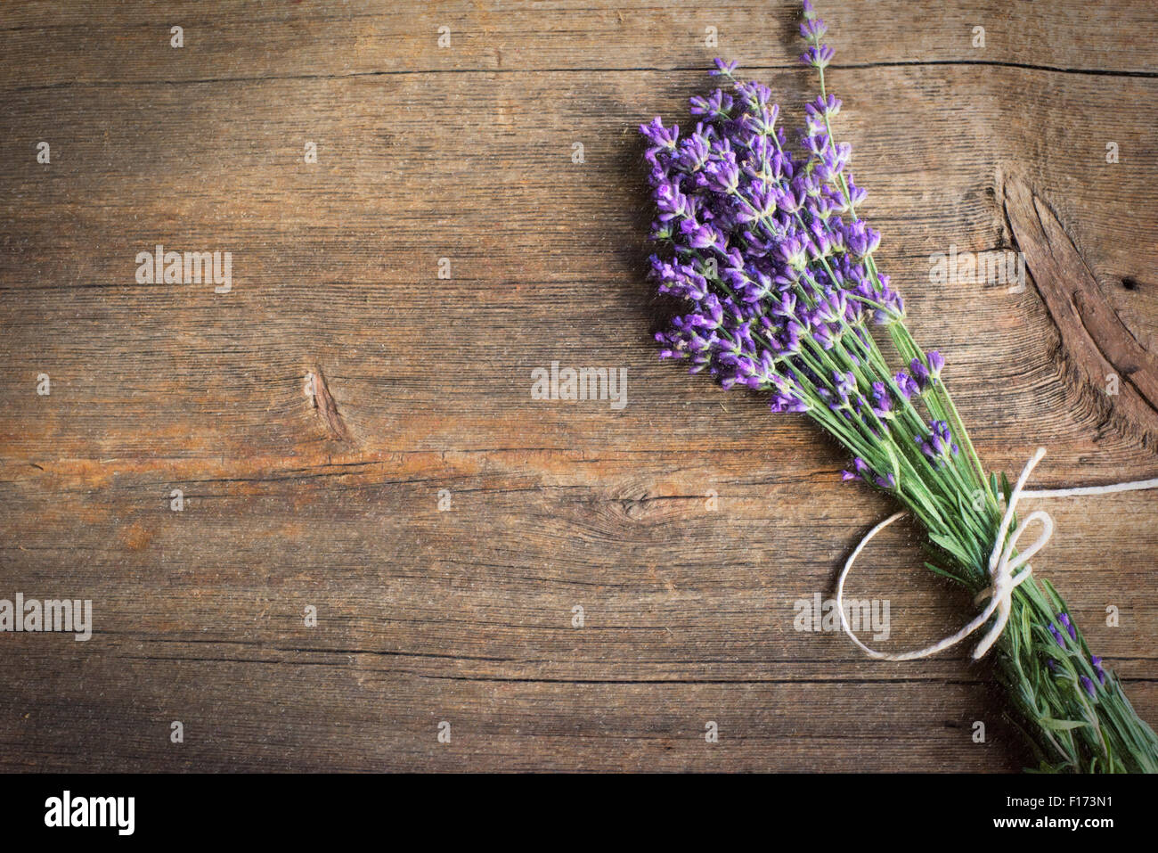 Lavender in a bunch tied with string on a rustic wood background Stock ...