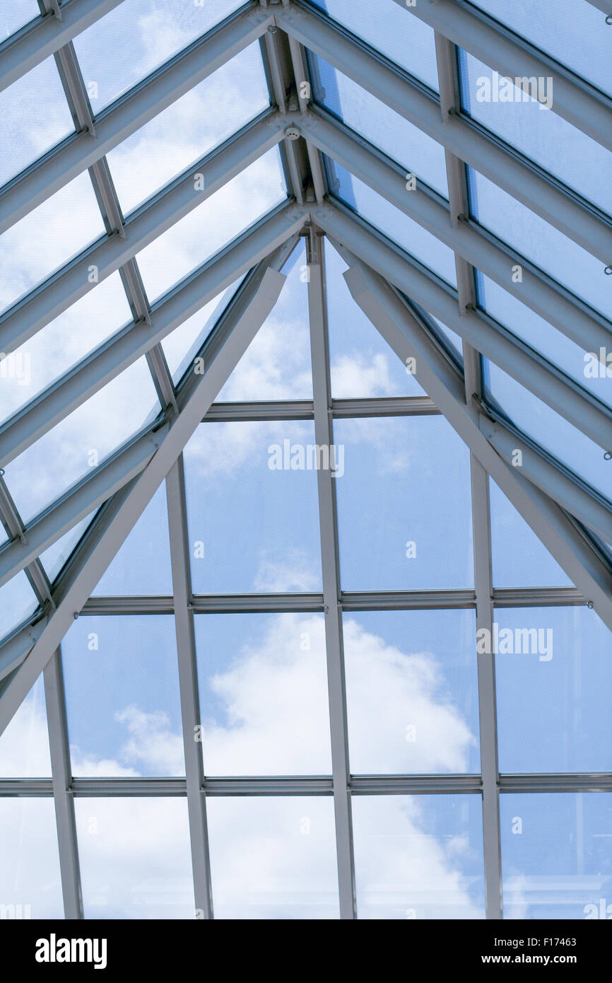 Glass skylight ceiling with blue sky and clouds Stock Photo - Alamy