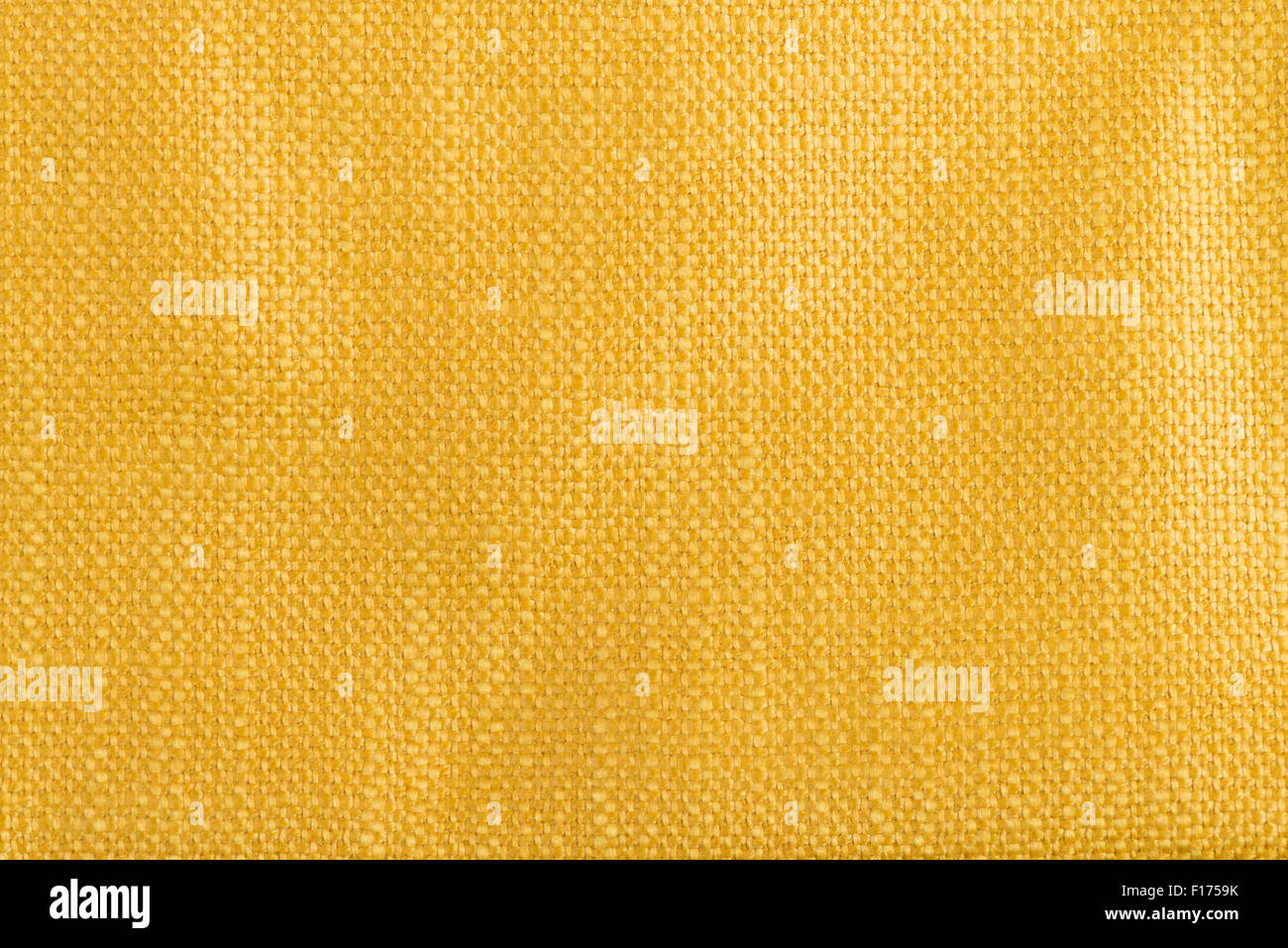 Closeup detail of yellow fabric texture background Stock Photo - Alamy