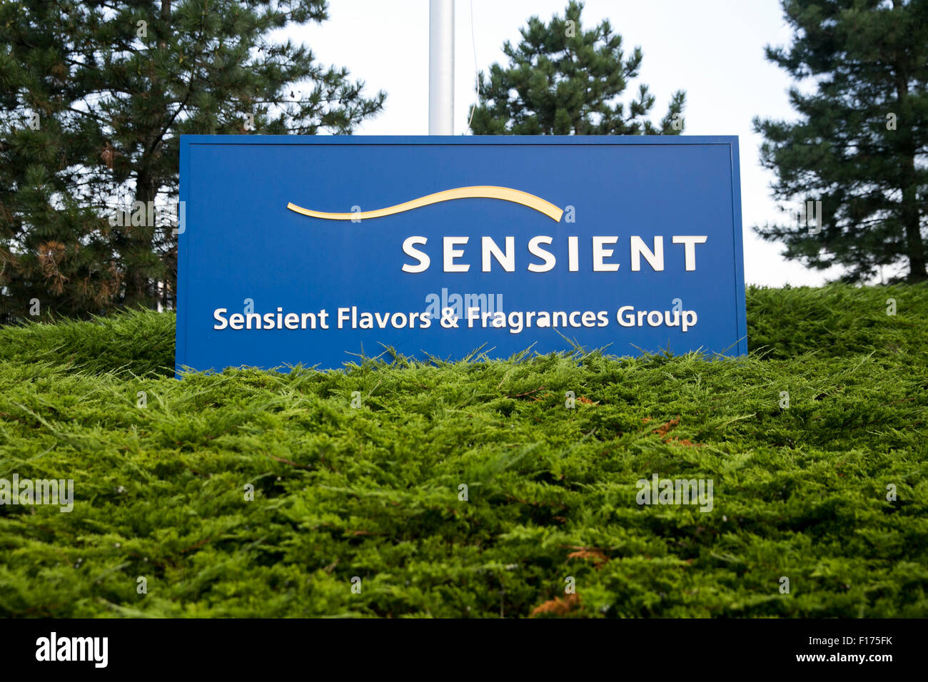 A logo sign outside of a facility occupied by the Sensient Technologies ...