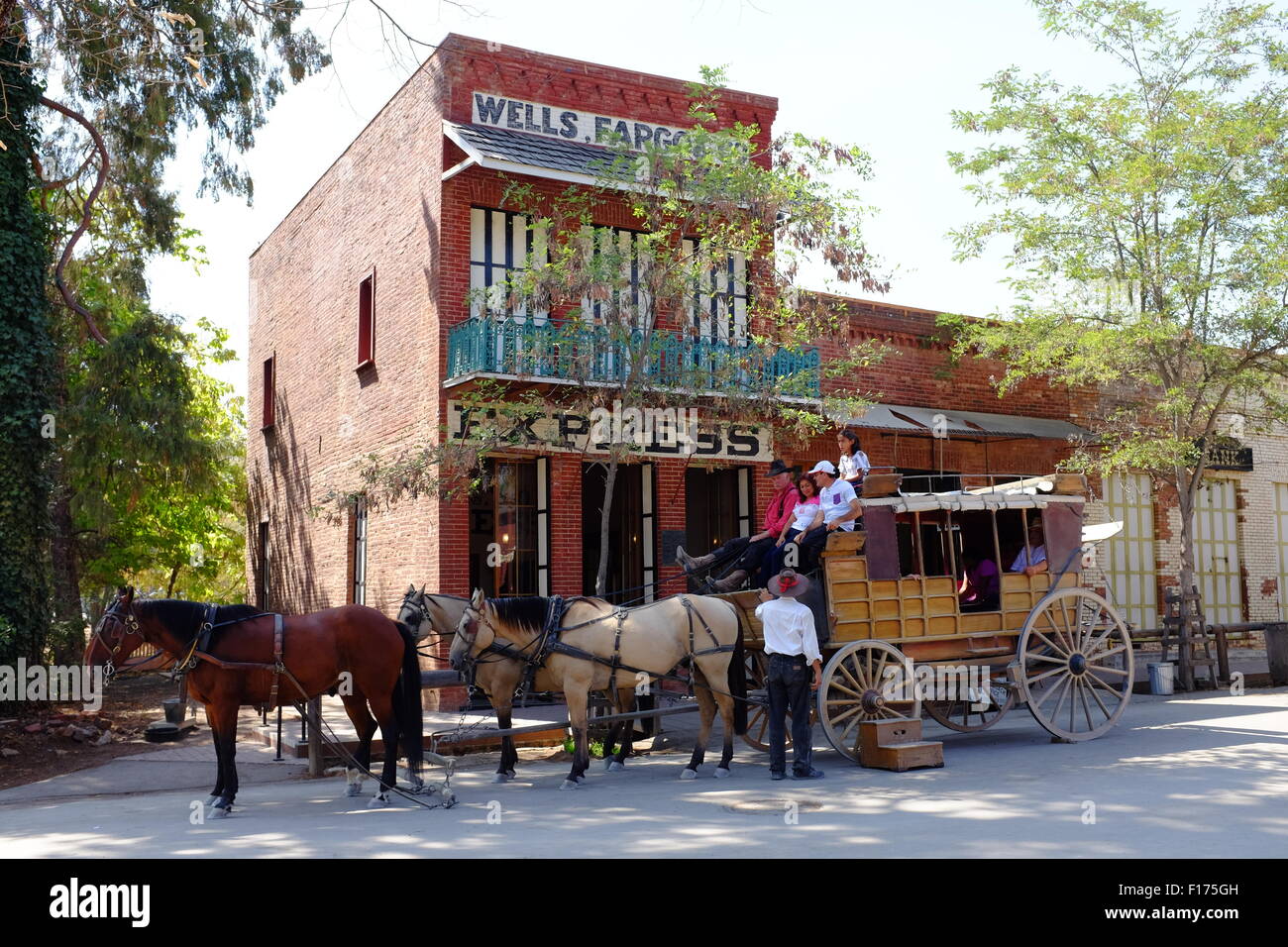 Tourists prepare to ride a stagecoach in Columbia State Historic Park ...