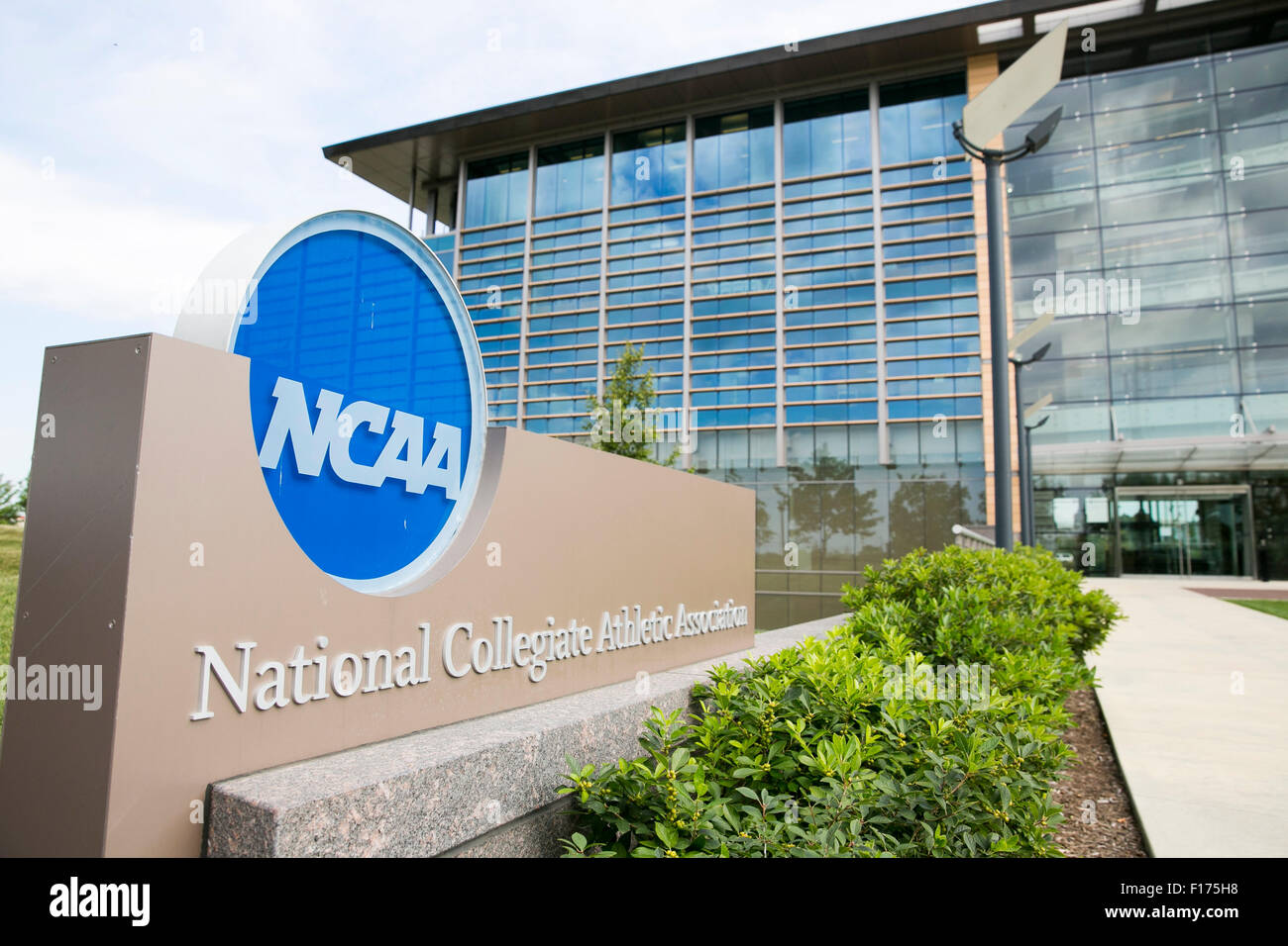 A logo sign outside of the headquarters of the National Collegiate ...