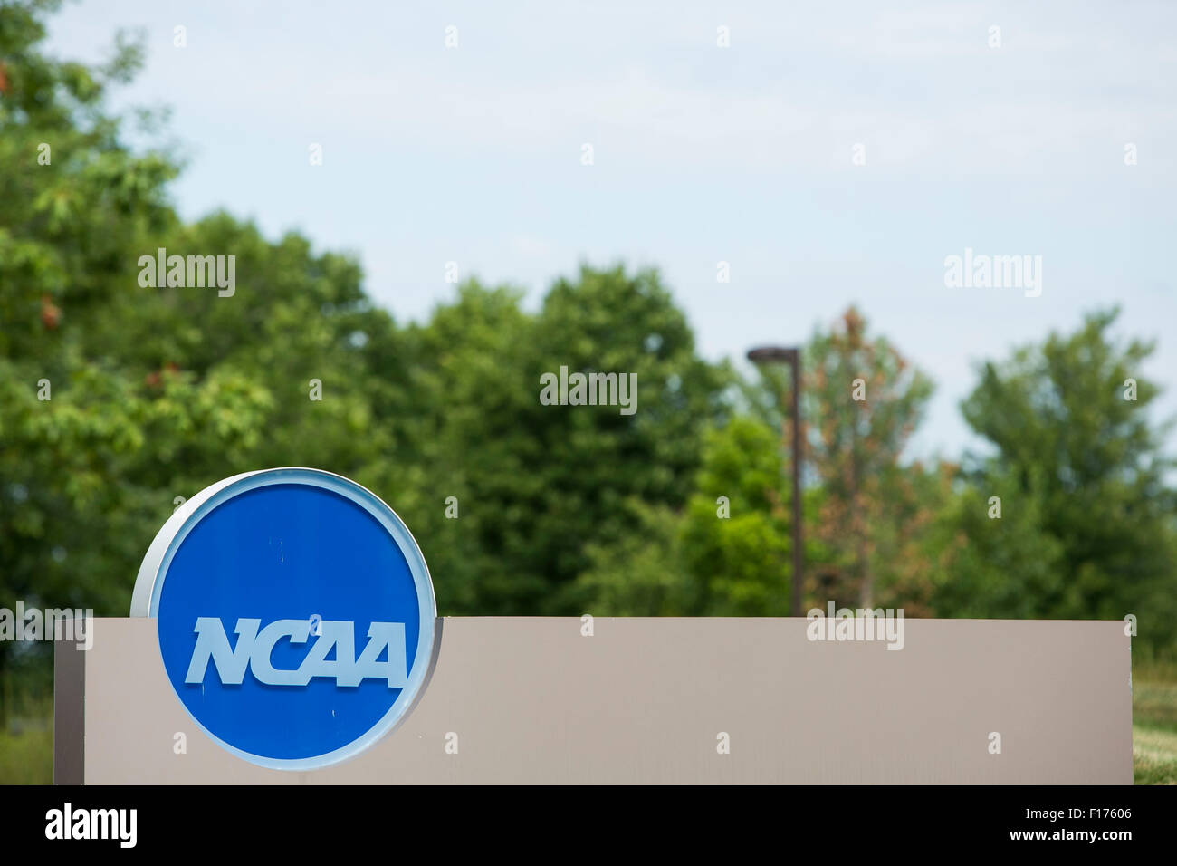 A logo sign outside of the headquarters of the National Collegiate ...