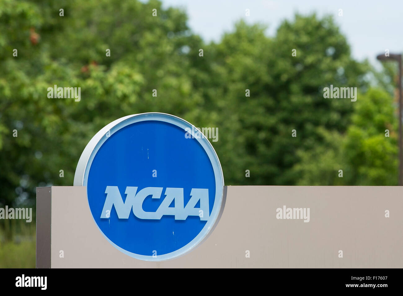 A logo sign outside of the headquarters of the National Collegiate ...
