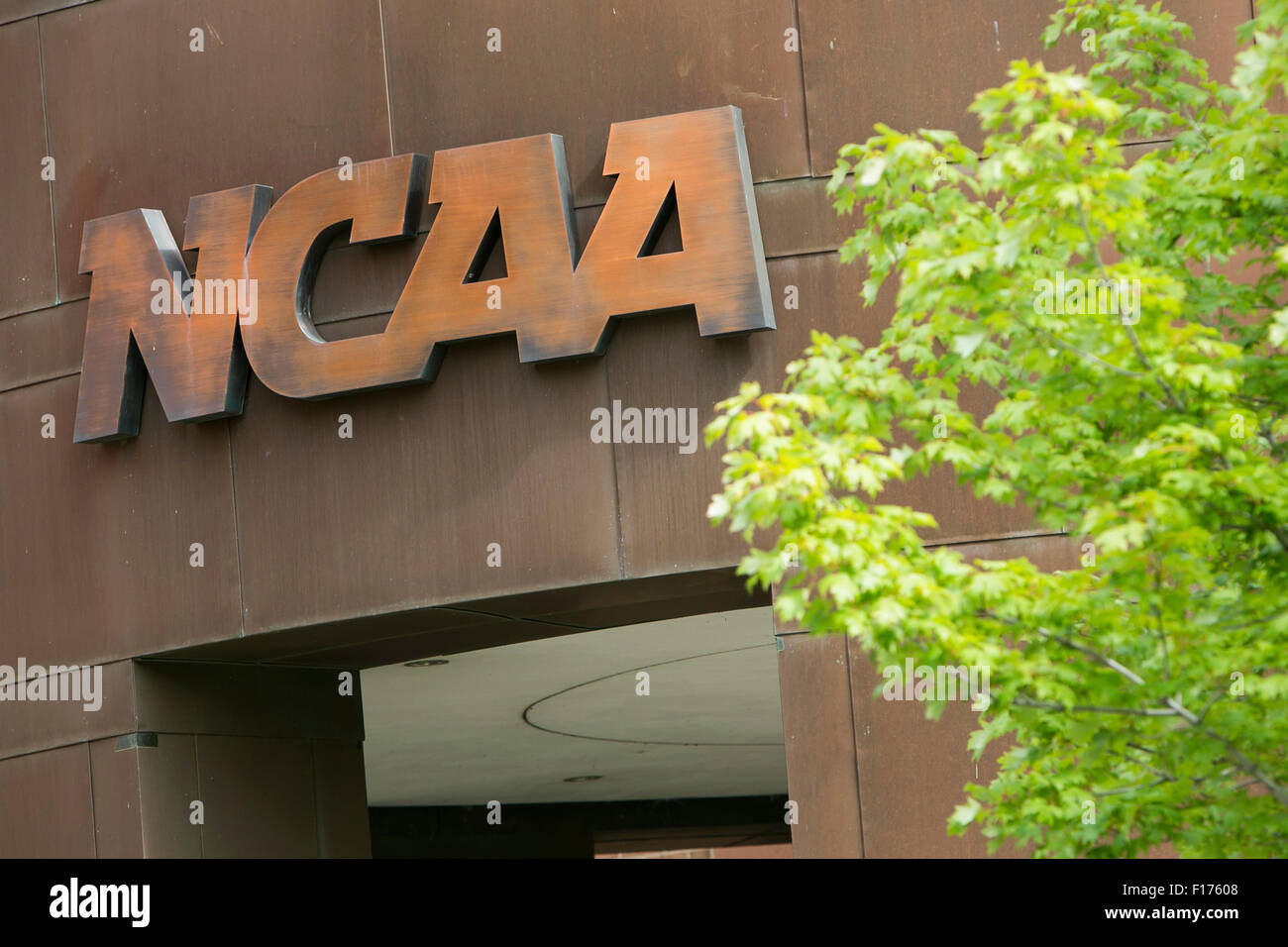 A logo sign outside of the headquarters of the National Collegiate ...