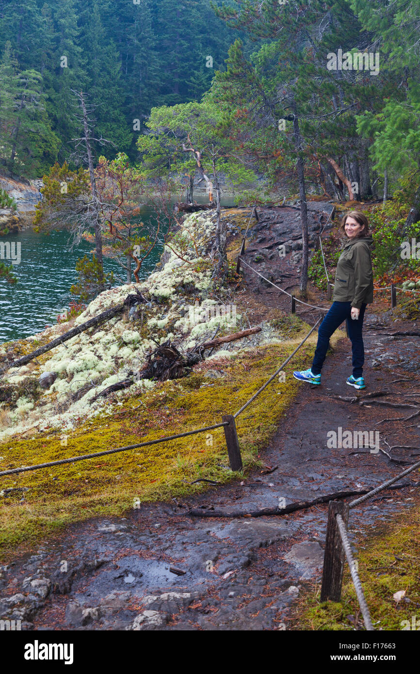 Woman walking on rocky viewpoint hi-res stock photography and images ...
