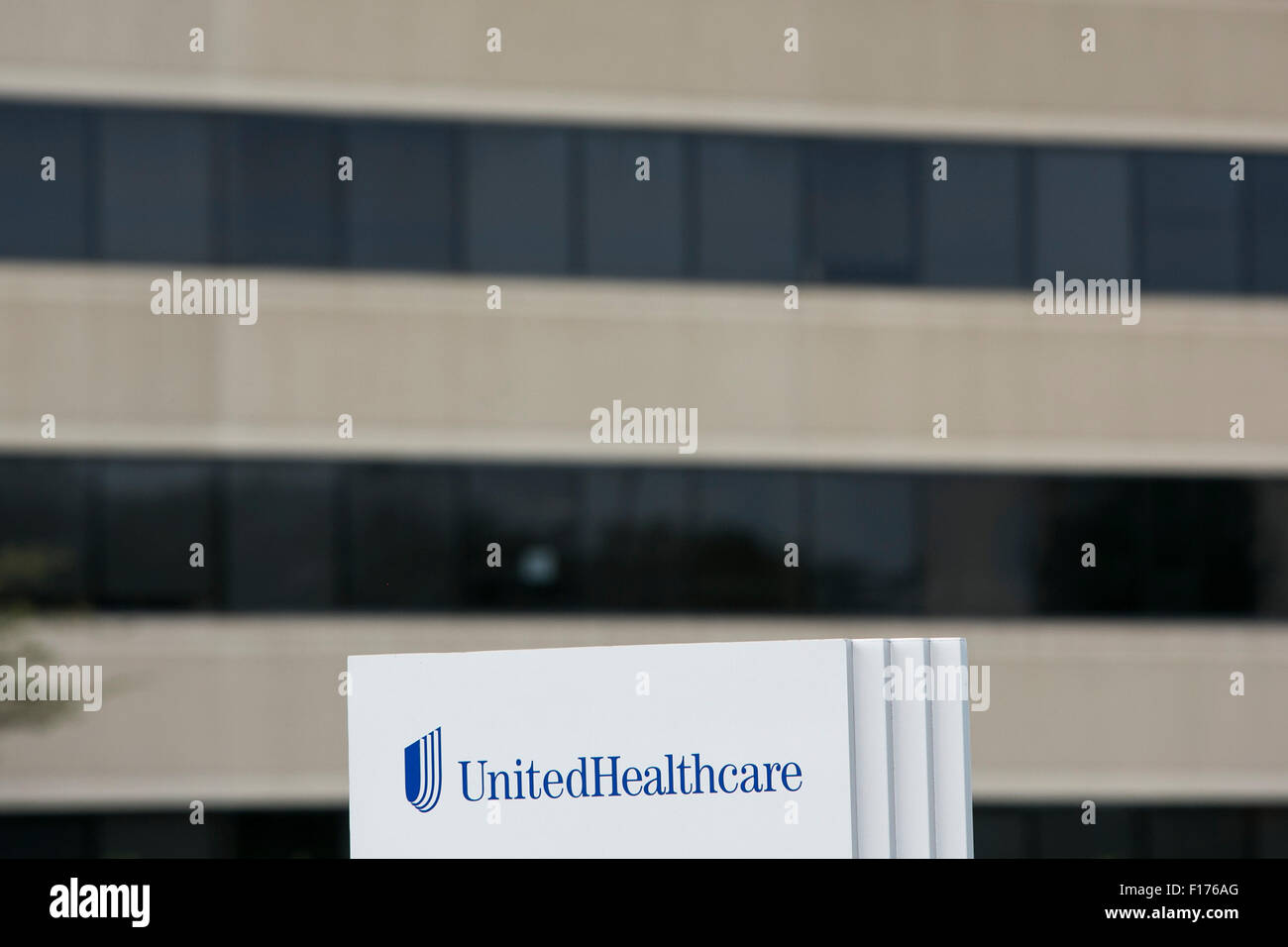 A logo sign outside of a facility occupied by UnitedHealthcare in ...