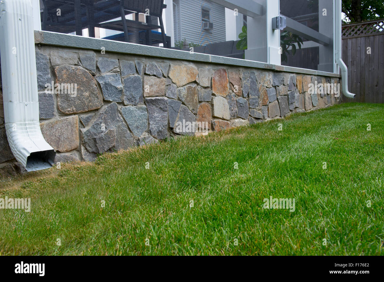 Home rain water drainage downspout gutters on the exterior of a single ...