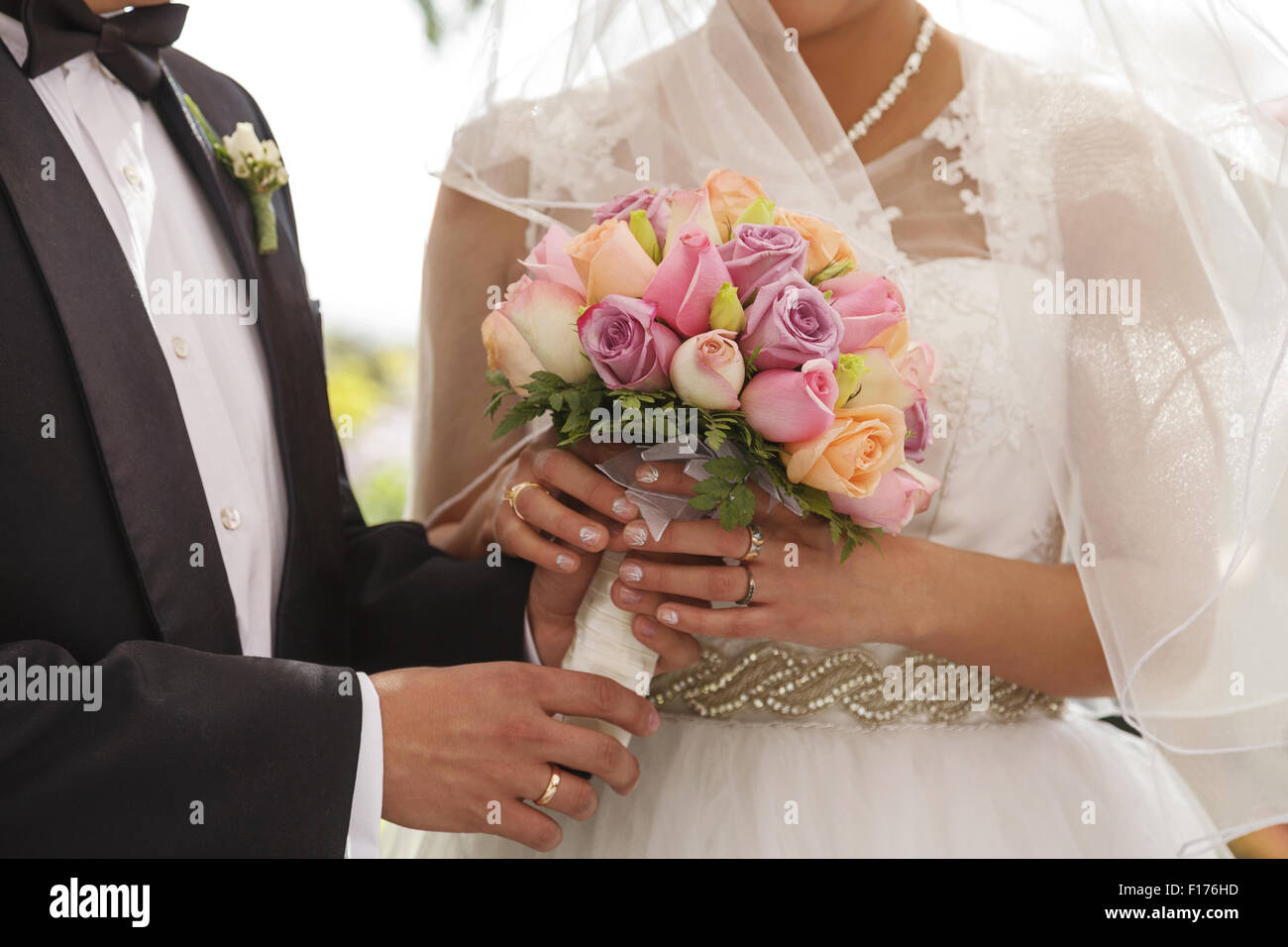 bride and groom holding hands Stock Photo - Alamy