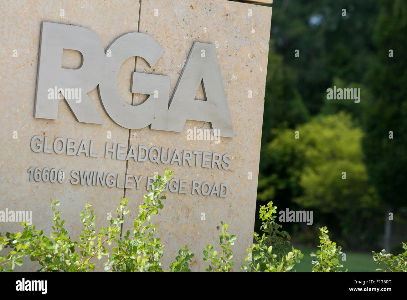 A logo sign outside of the headquarters of Reinsurance Group of America ...