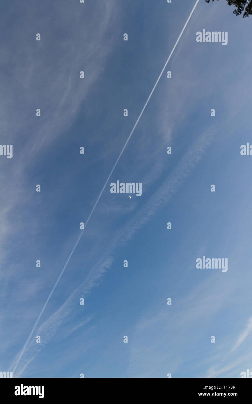 wide angle with the moon in the middle and lingering trails across the ...