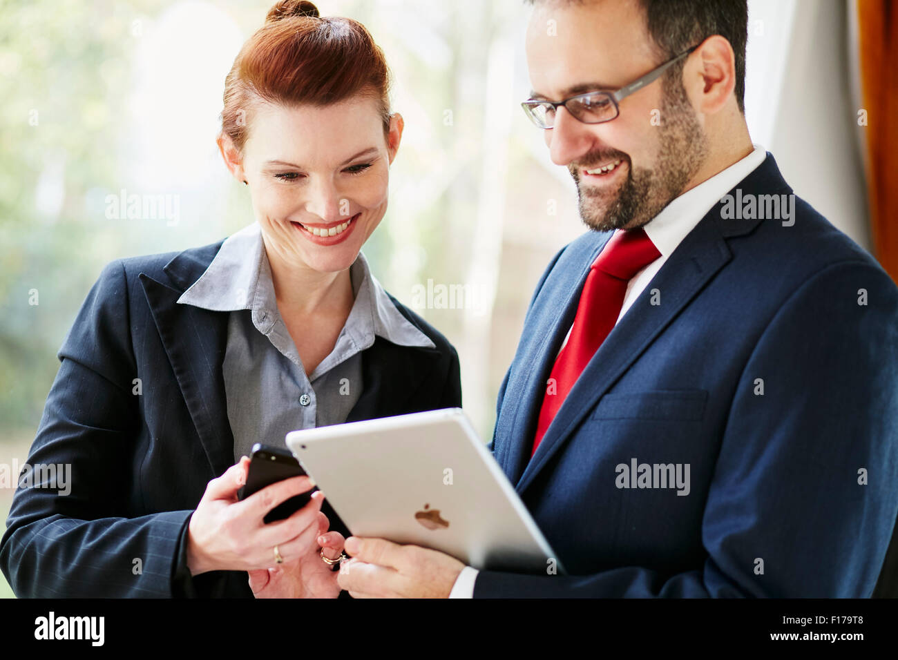 Two business people discussing work Stock Photo - Alamy Two business people discussing work Stock Photo - Alamy