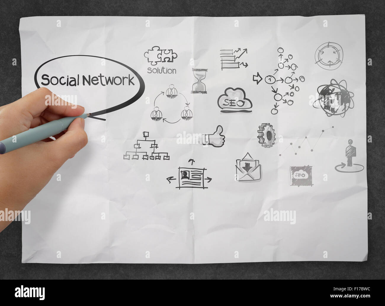 hand drawing social media icon on crumpled paper as concept Stock Photo ...
